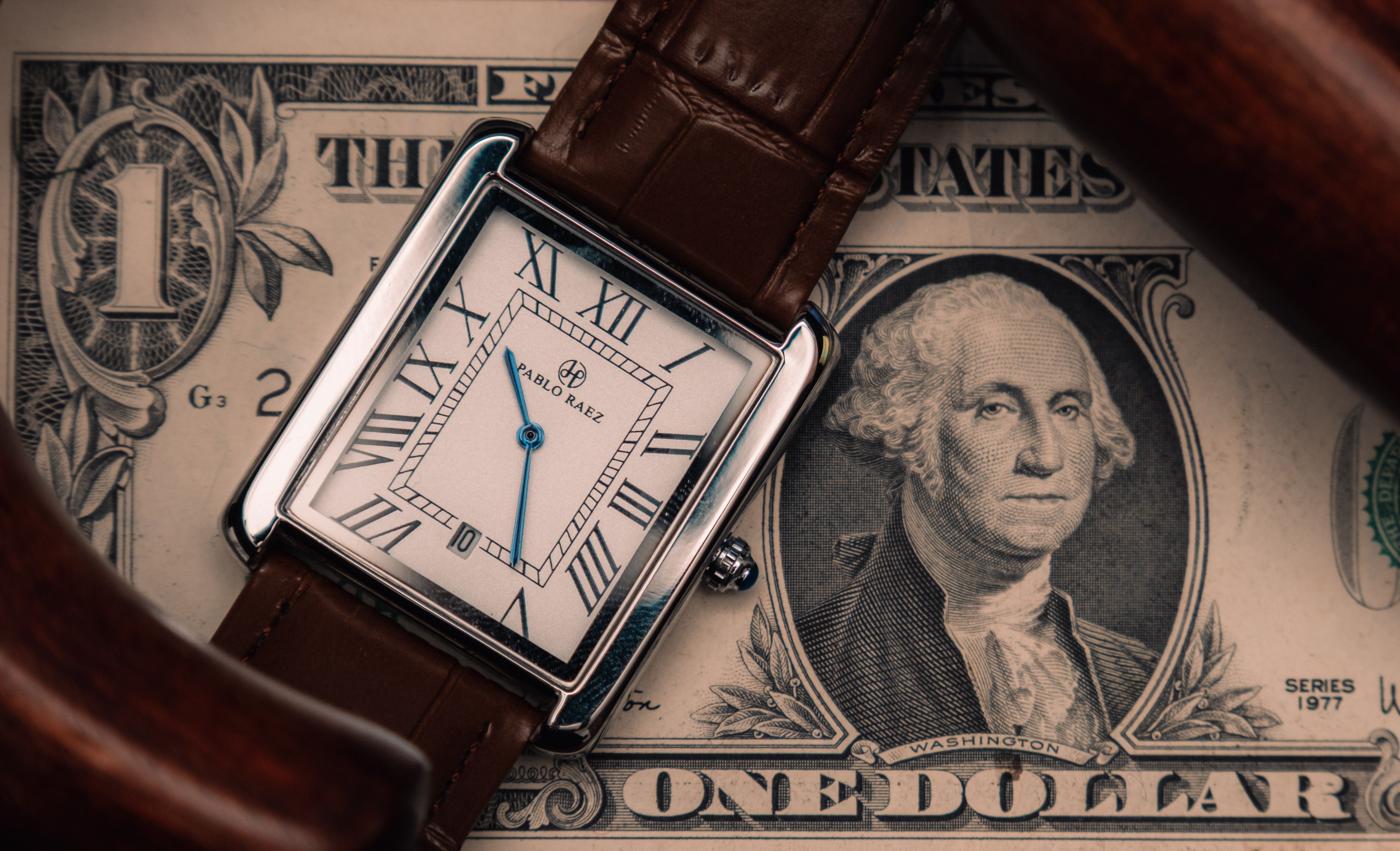 Luxury Watch on Dollar Bill Background · Free Stock Photo