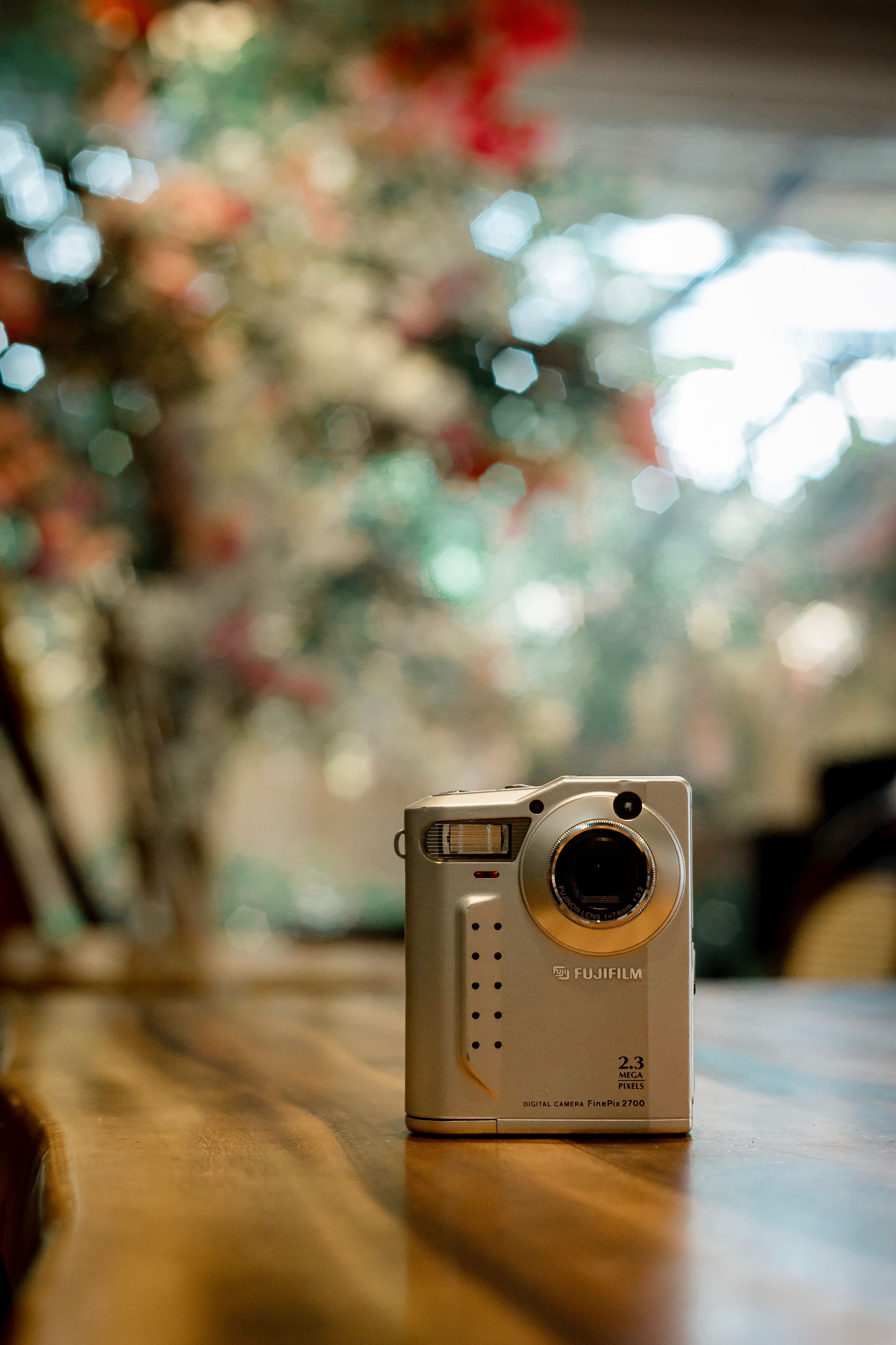 Vintage Fujifilm Camera on Wooden Table · Free Stock Photo
