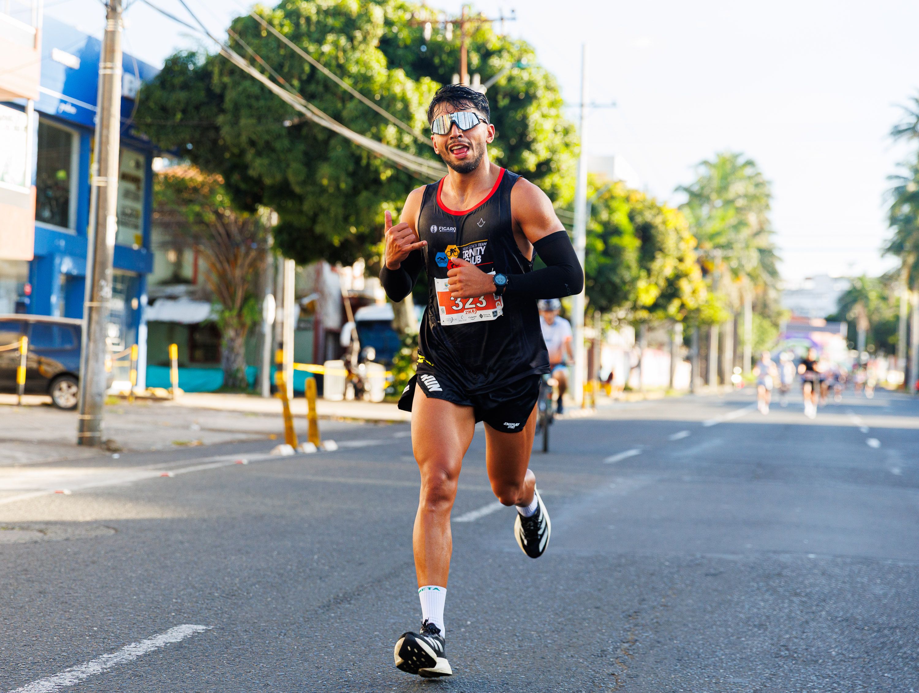 Female and Male Runners on a Marathon · Free Stock Photo