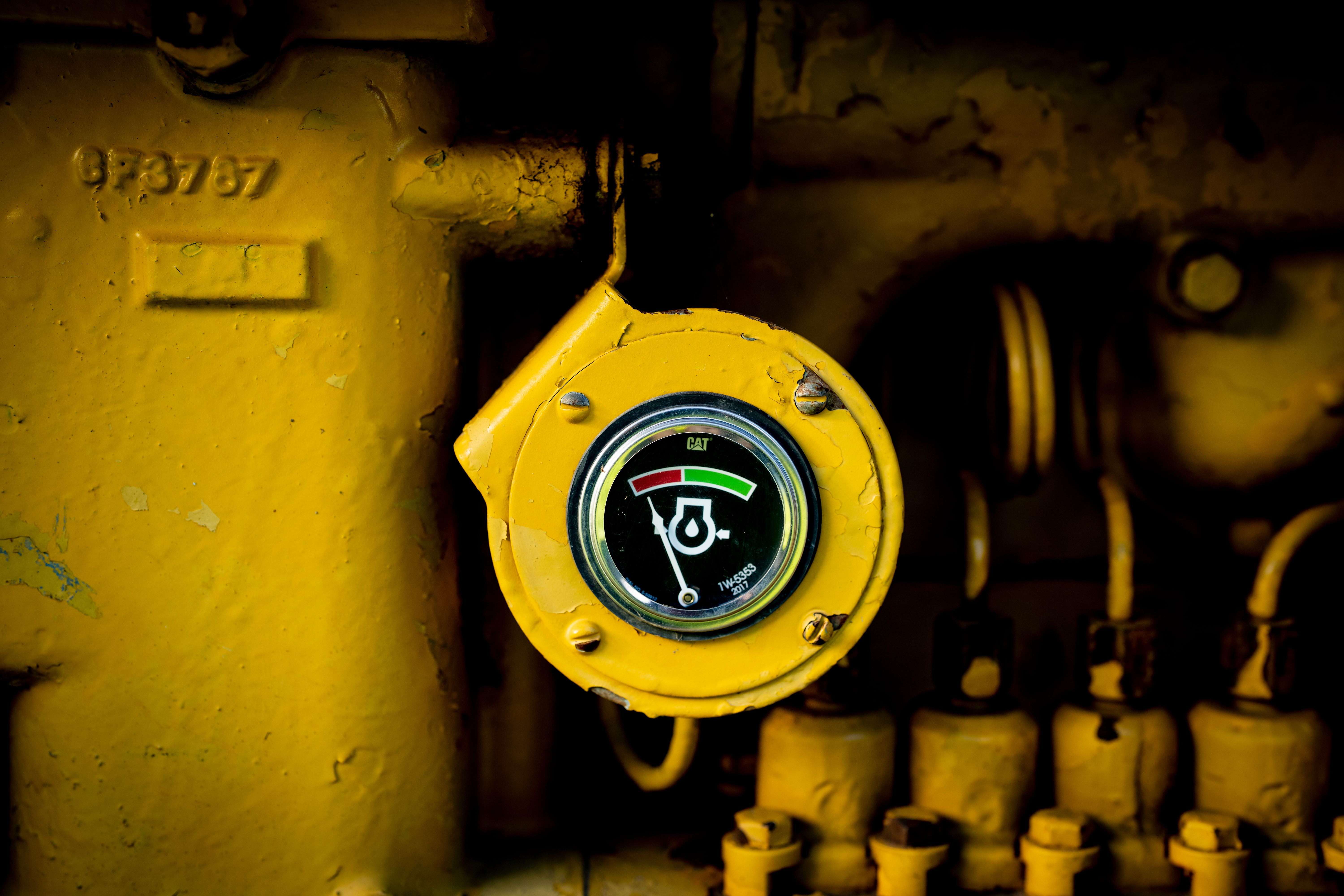 Close-up of Yellow Industrial Gauge on Equipment · Free Stock Photo