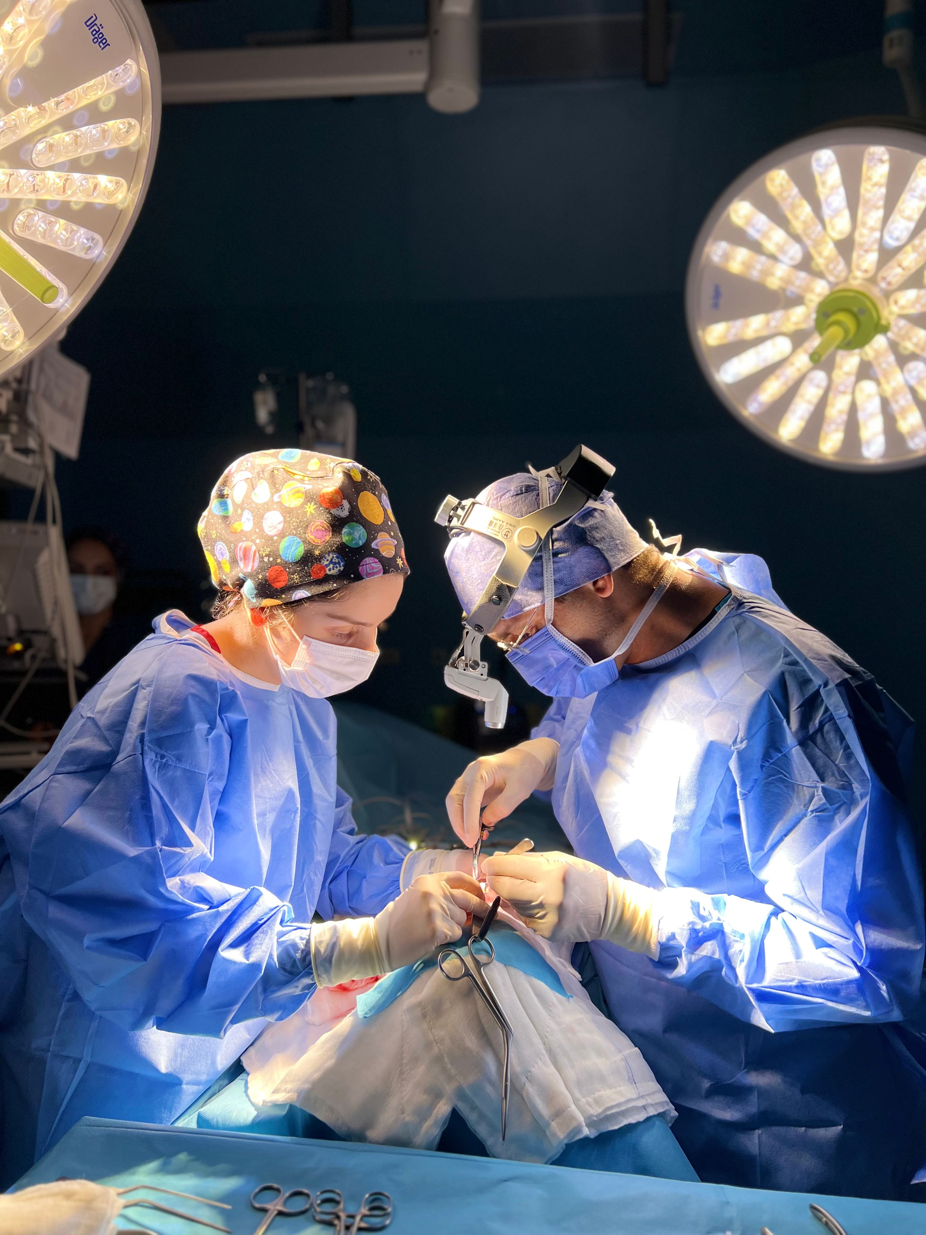 Surgeons Performing Surgery in Operating Room · Free Stock Photo