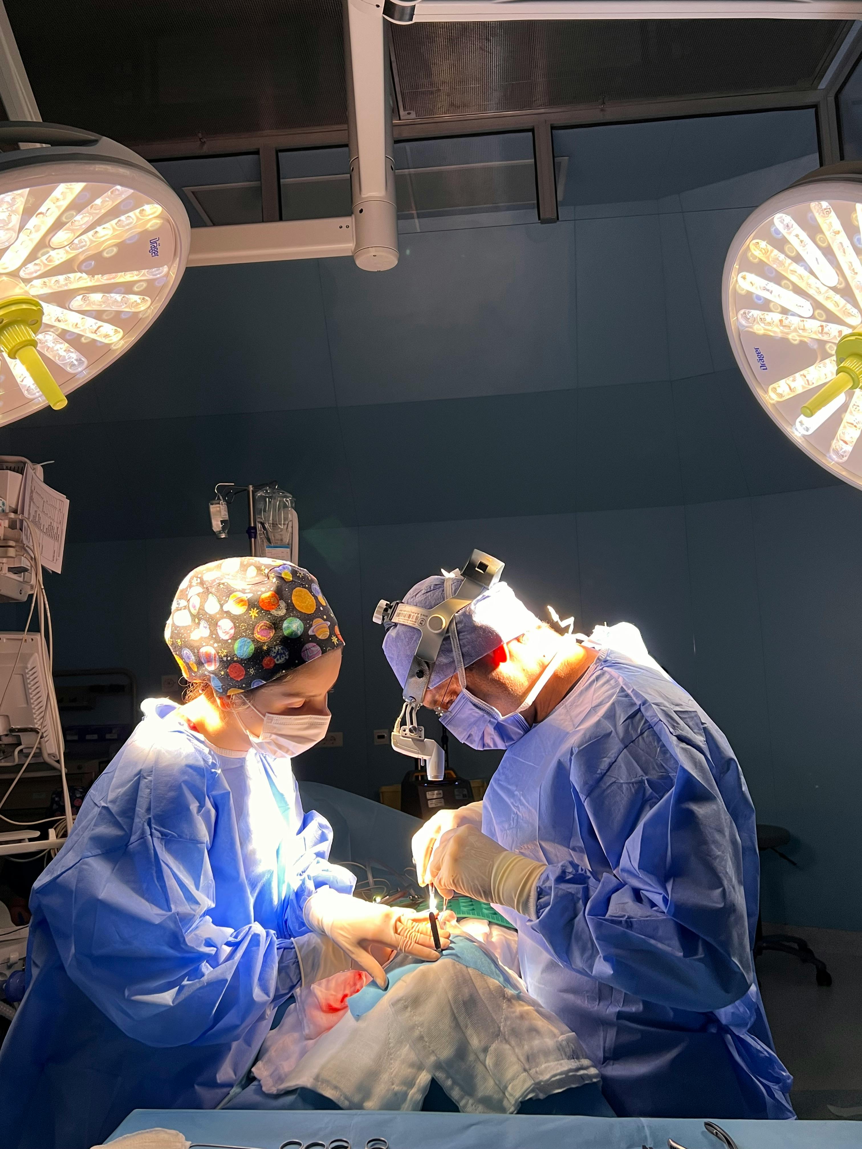 Surgical Team Performing Operation in Operating Room · Free Stock Photo