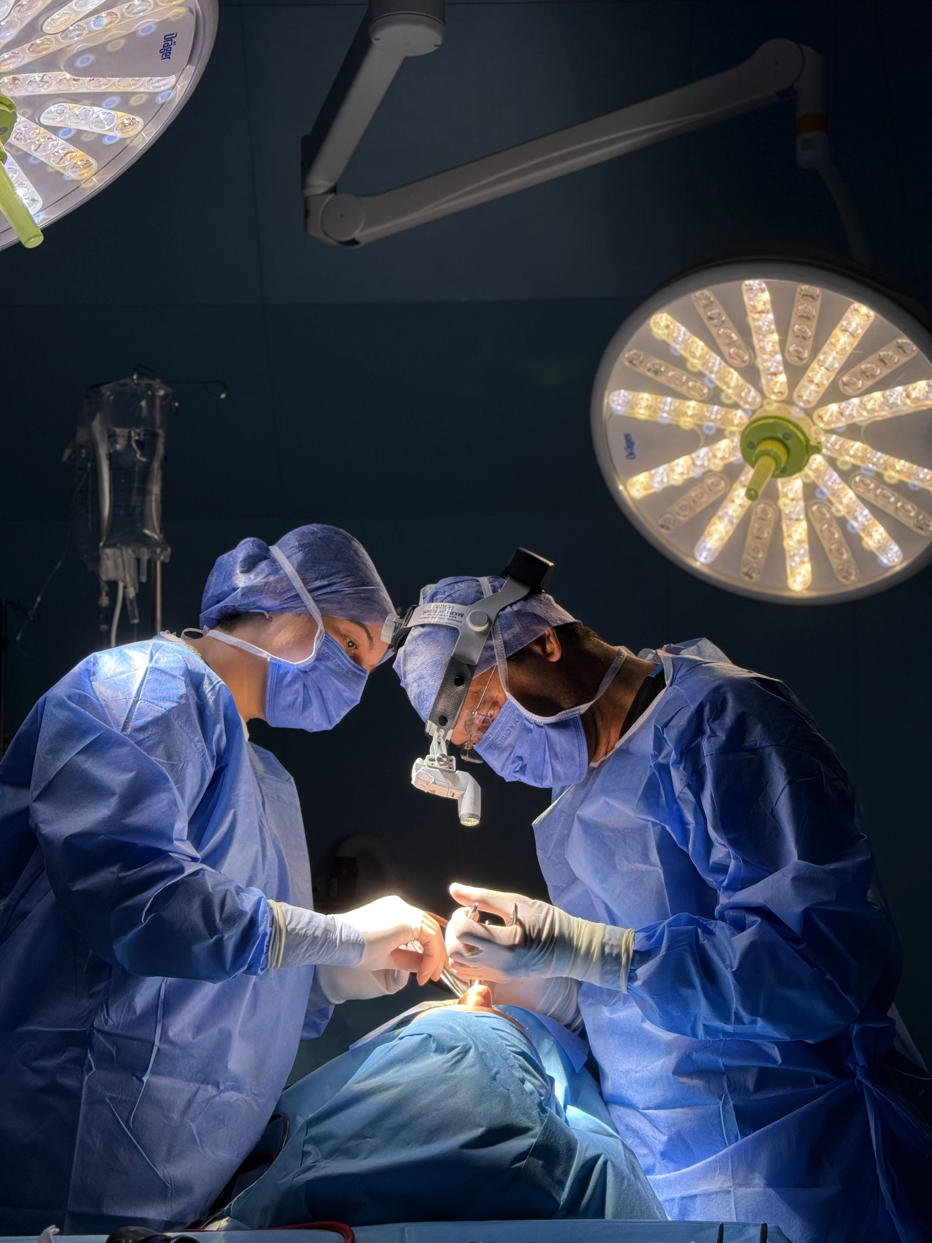 Surgical Team Performing in Operating Room · Free Stock Photo