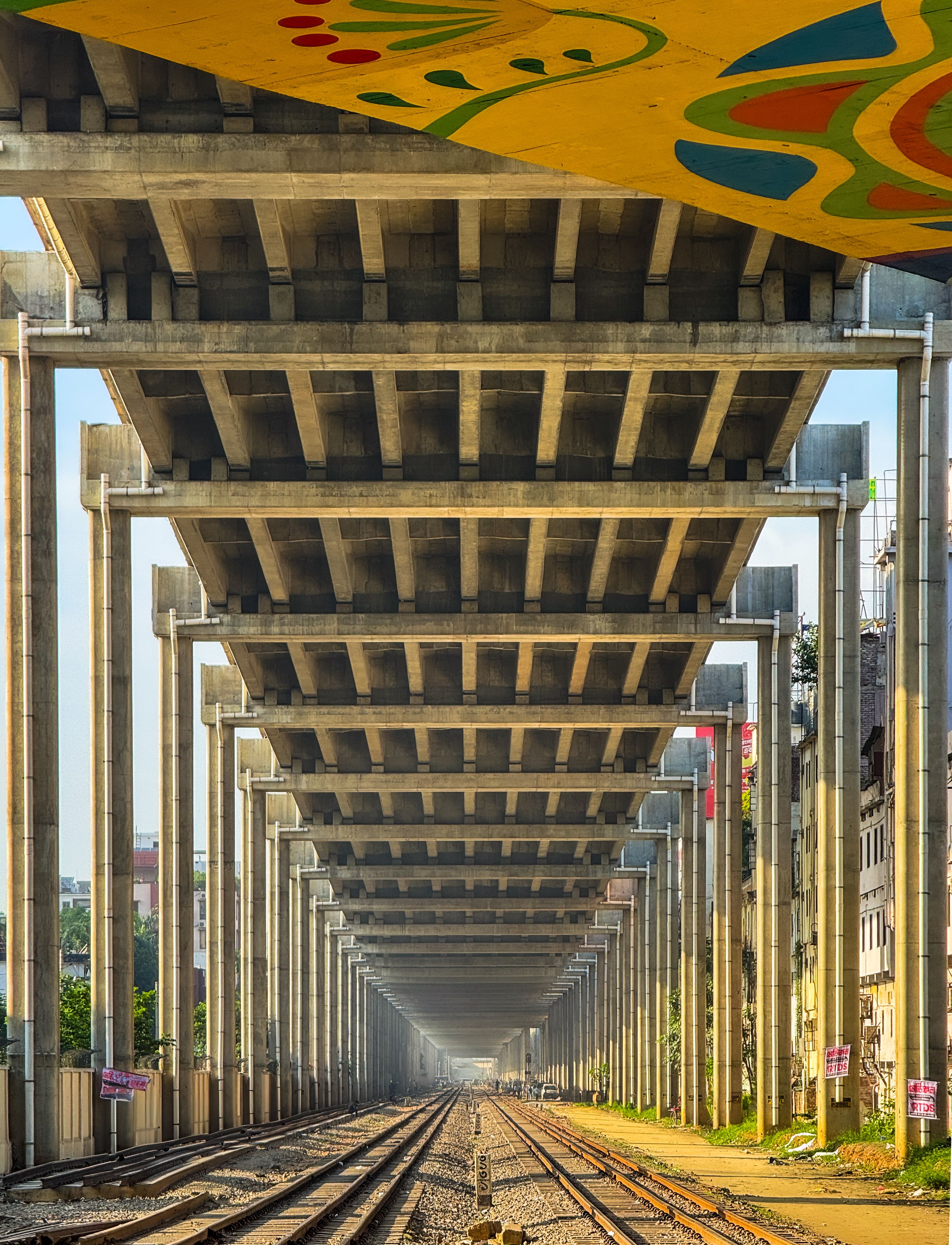 Symmetrical View Underneath Concrete Overpass · Free Stock Photo