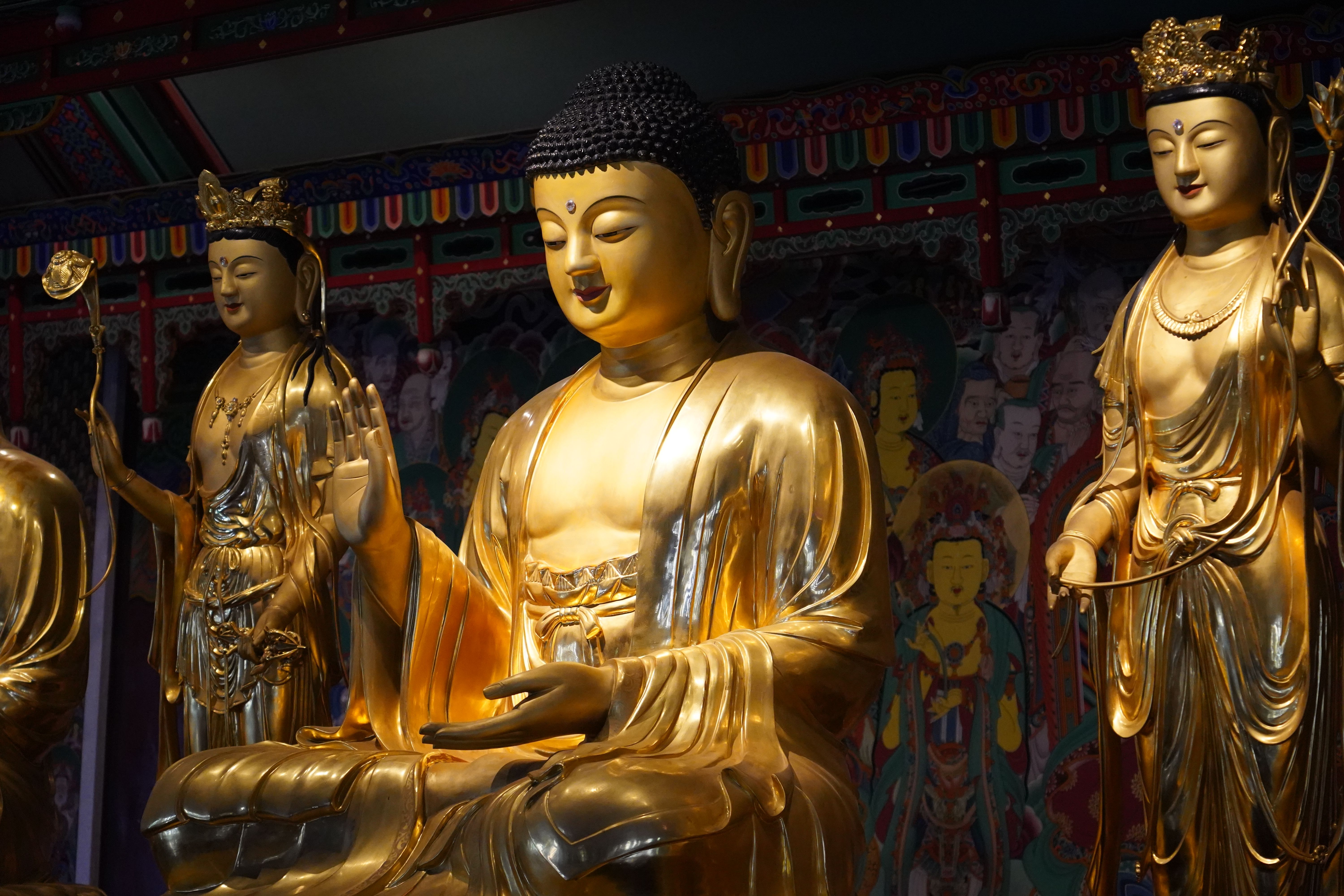Golden Buddhist Statues in Ornate Temple · Free Stock Photo