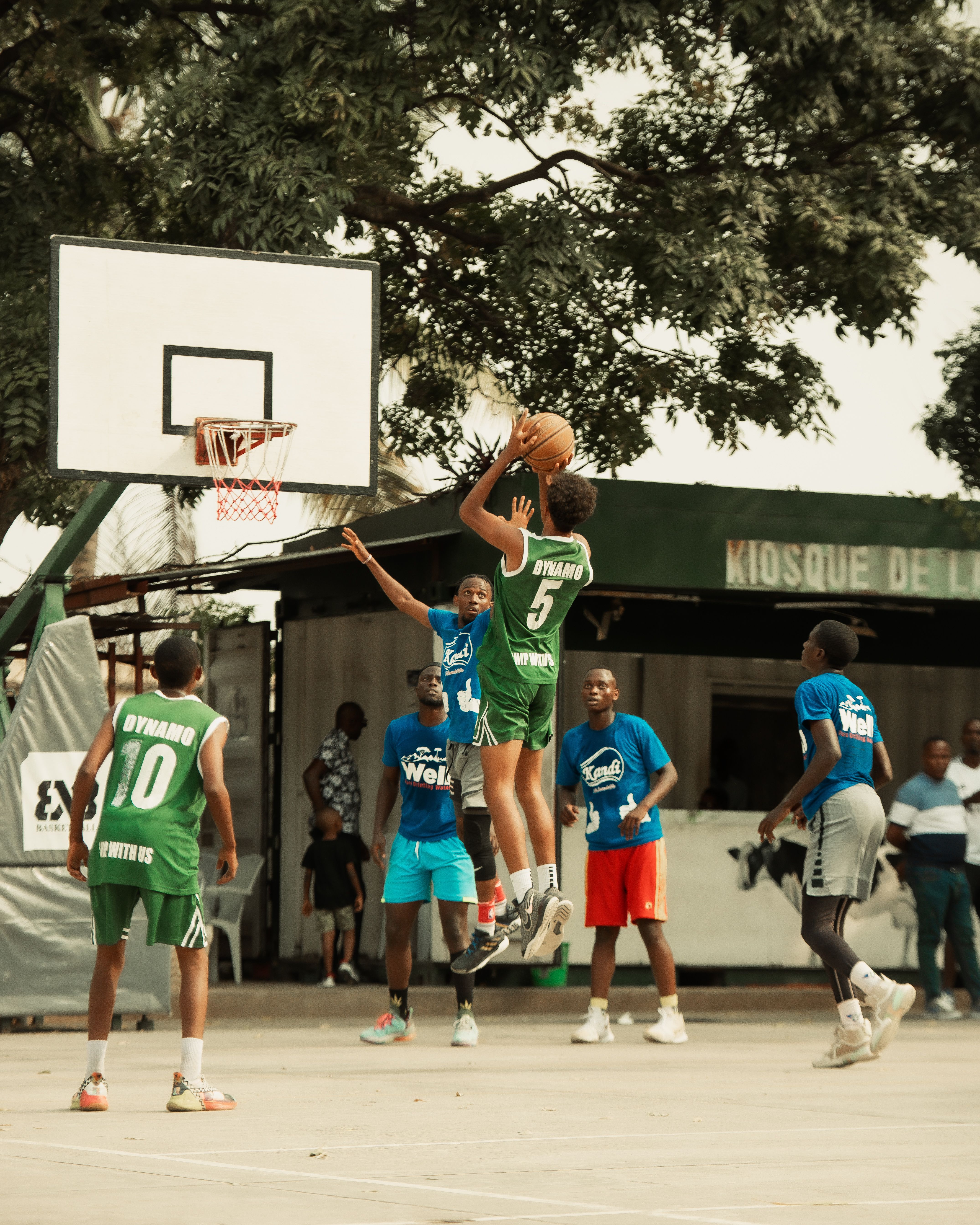 Energetic Outdoor Basketball Game in Action · Free Stock Photo