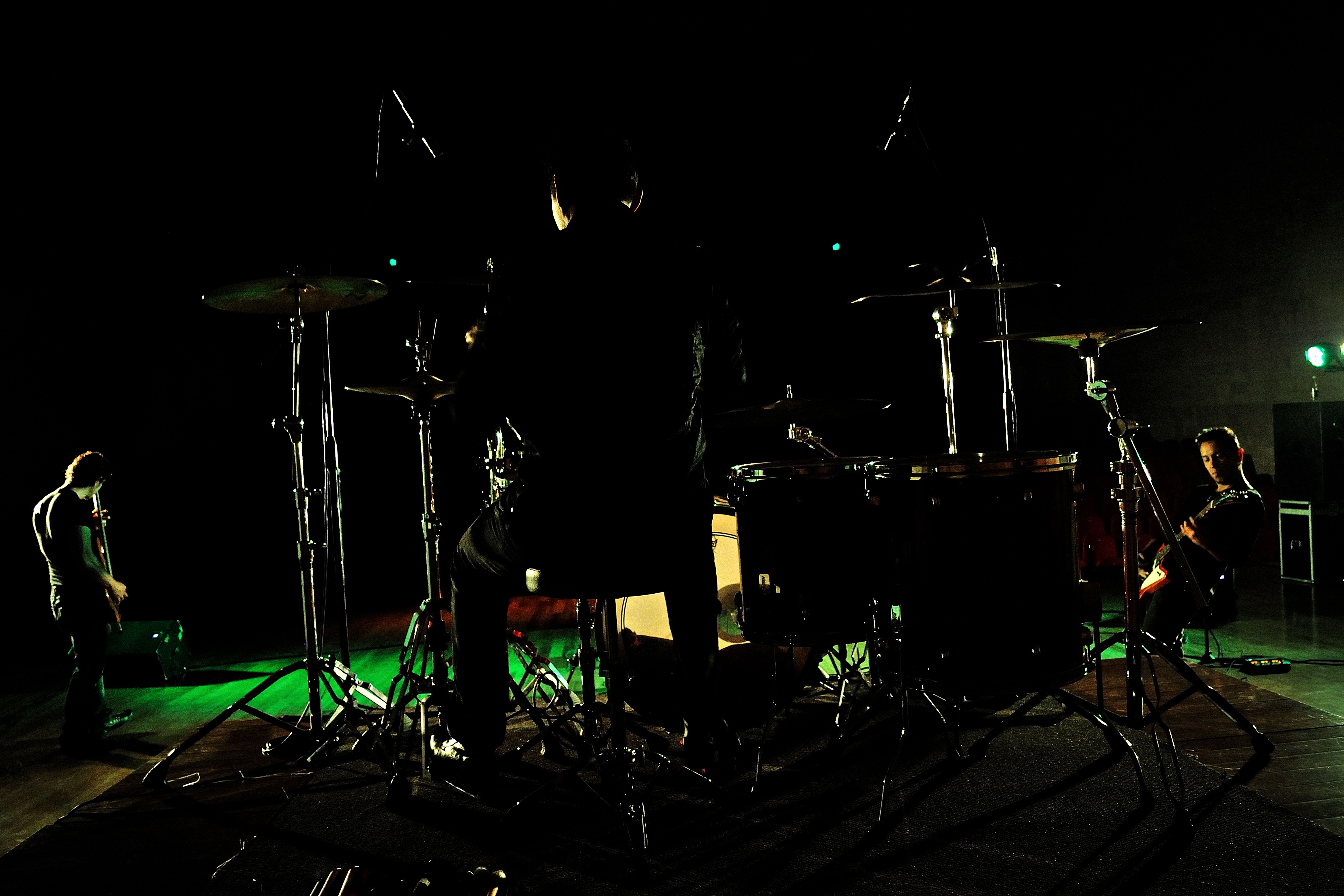 Energetic Rock Band Performance on Stage · Free Stock Photo
