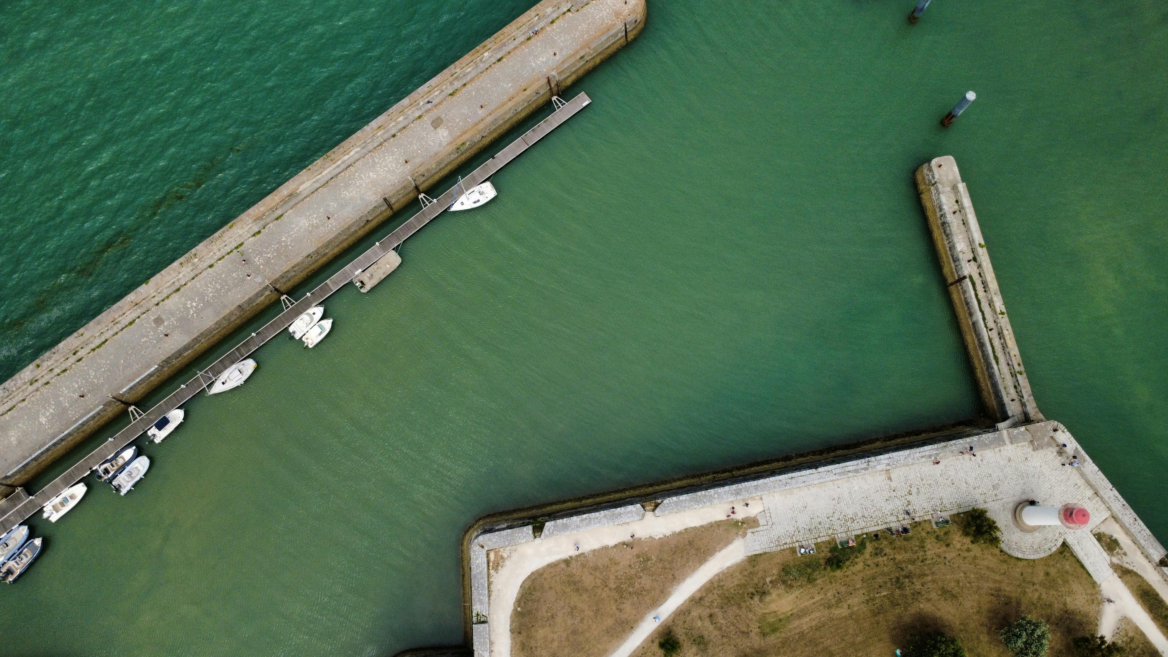 Aerial View of Harbor with Boats and Lighthouse · Free Stock Photo