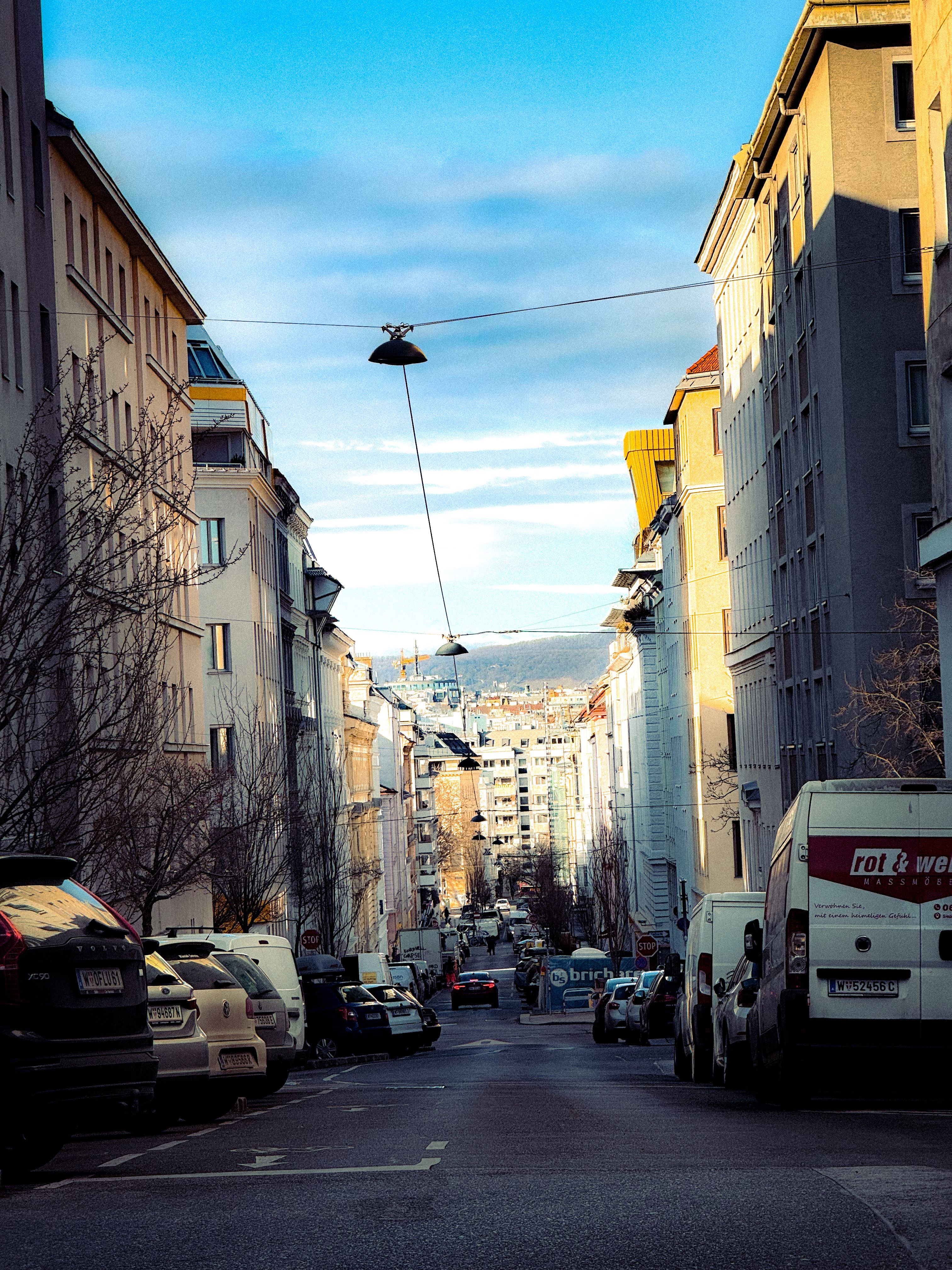 Scenic Street View in Vienna with Mountains · Free Stock Photo