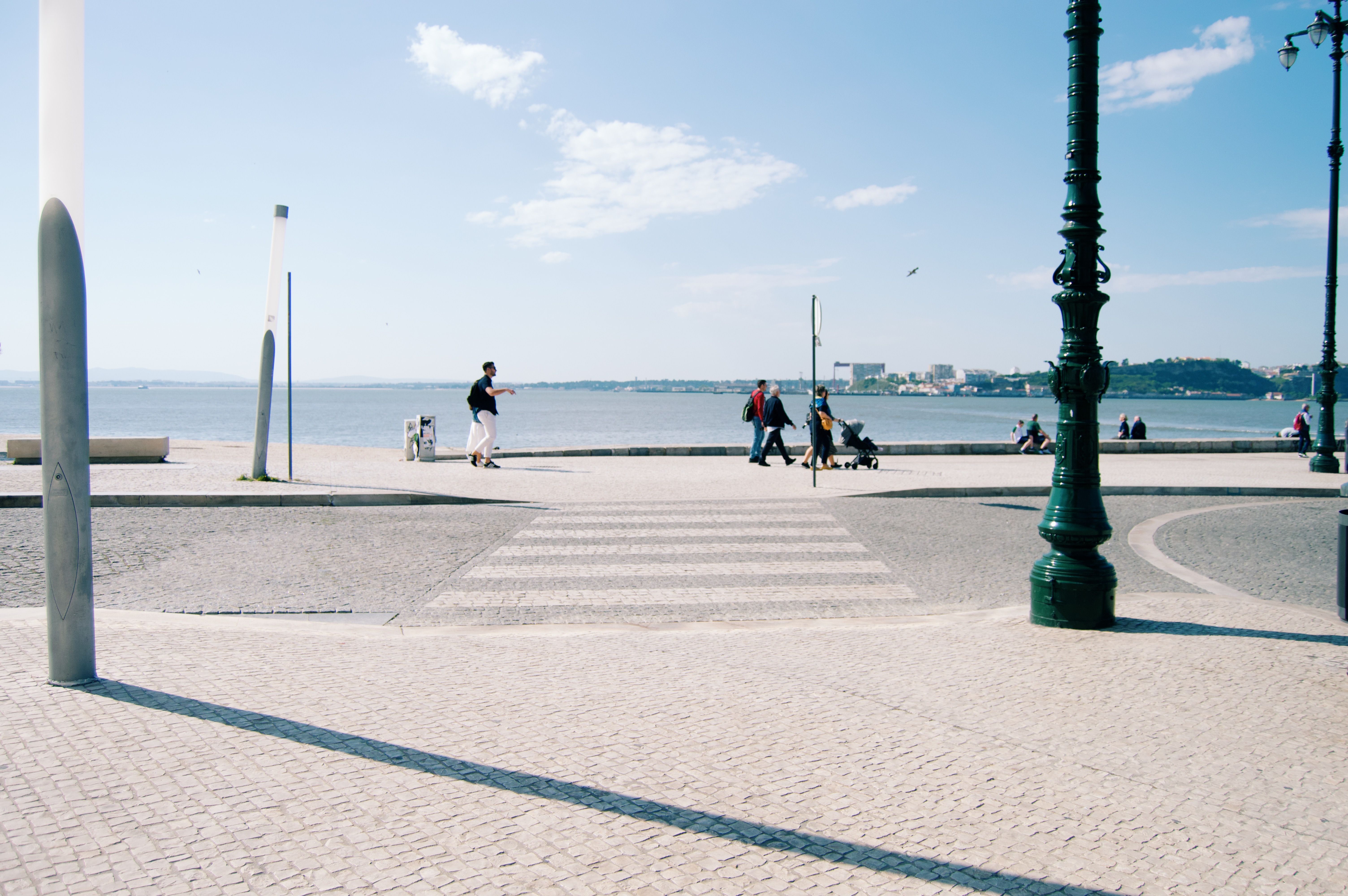 Woman standing on background while people walking on promenade · Free ...