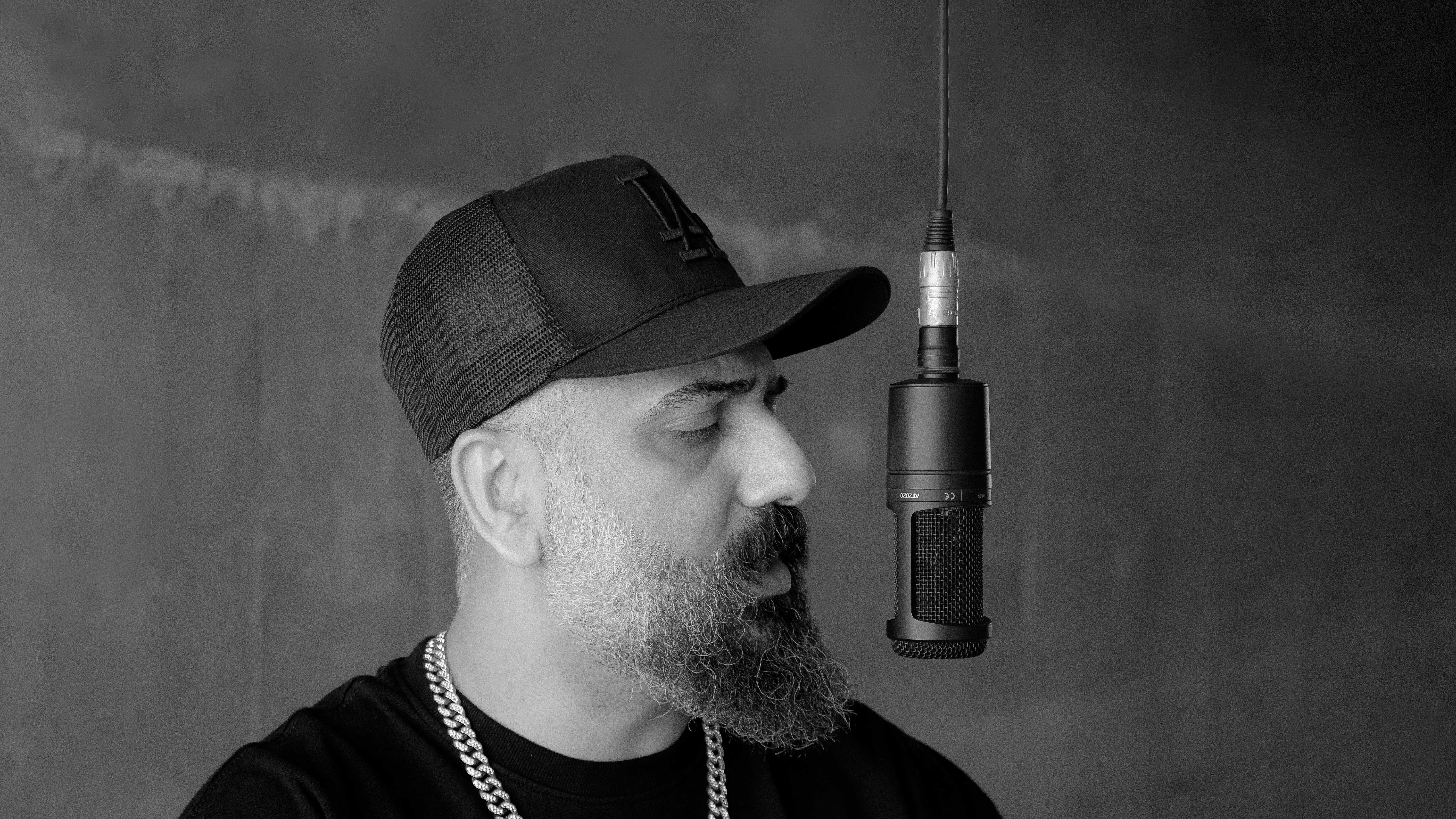 Portrait of a Bearded Rapper with Microphone · Free Stock Photo
