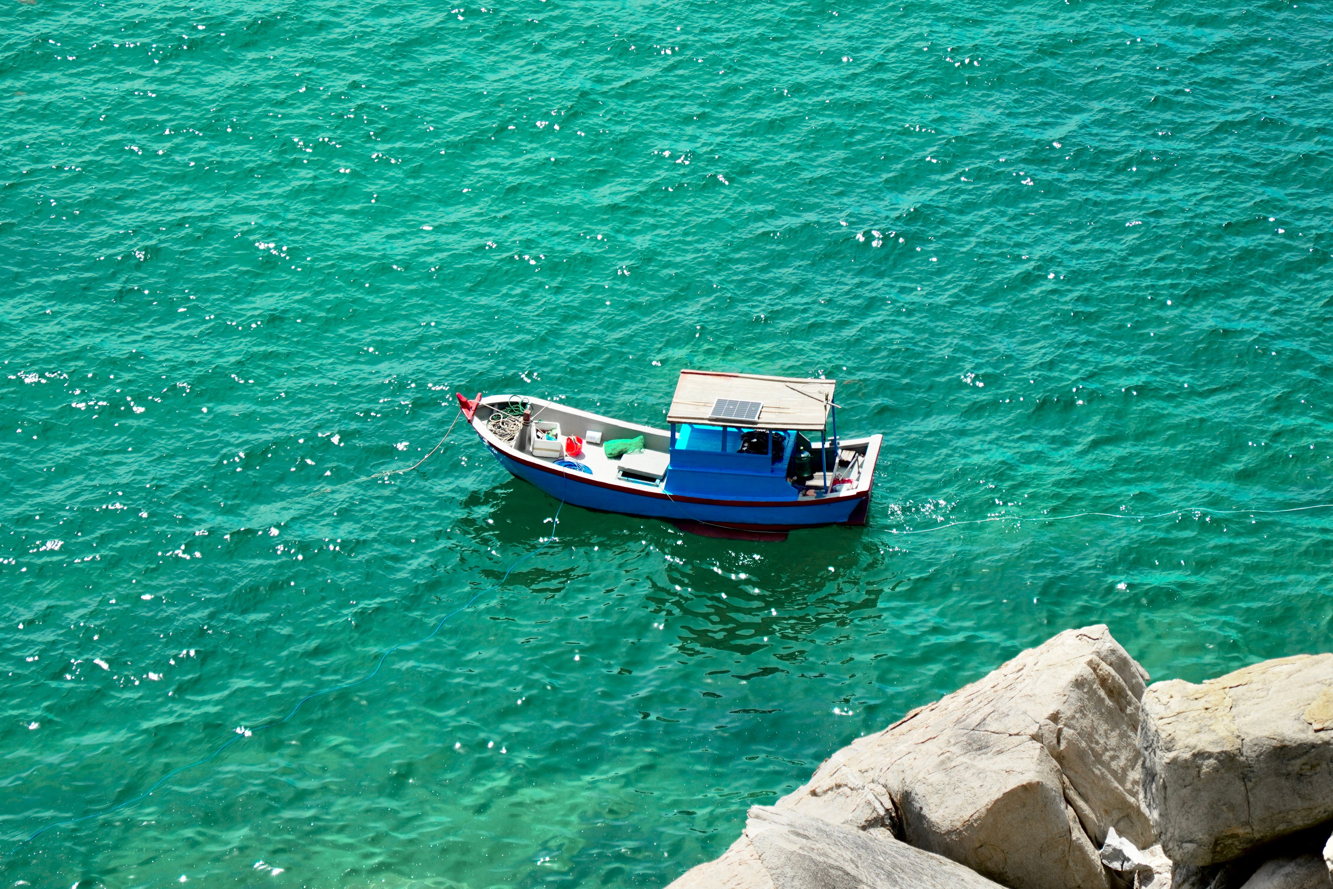 Small Boat In The Ocean Photos, Download The BEST Free Small Boat In ...