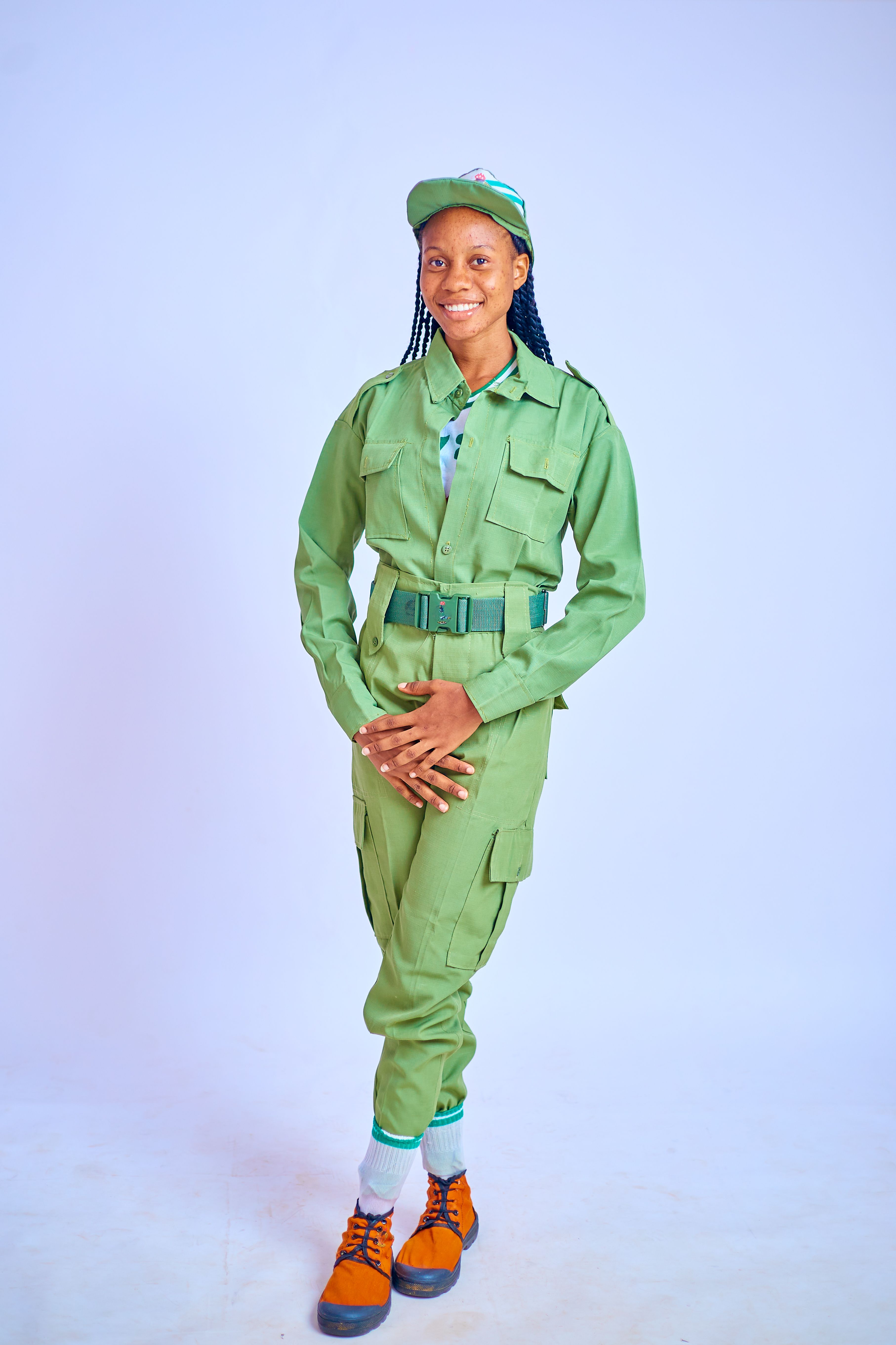 Young Adult in NYSC Uniform with Henna · Free Stock Photo