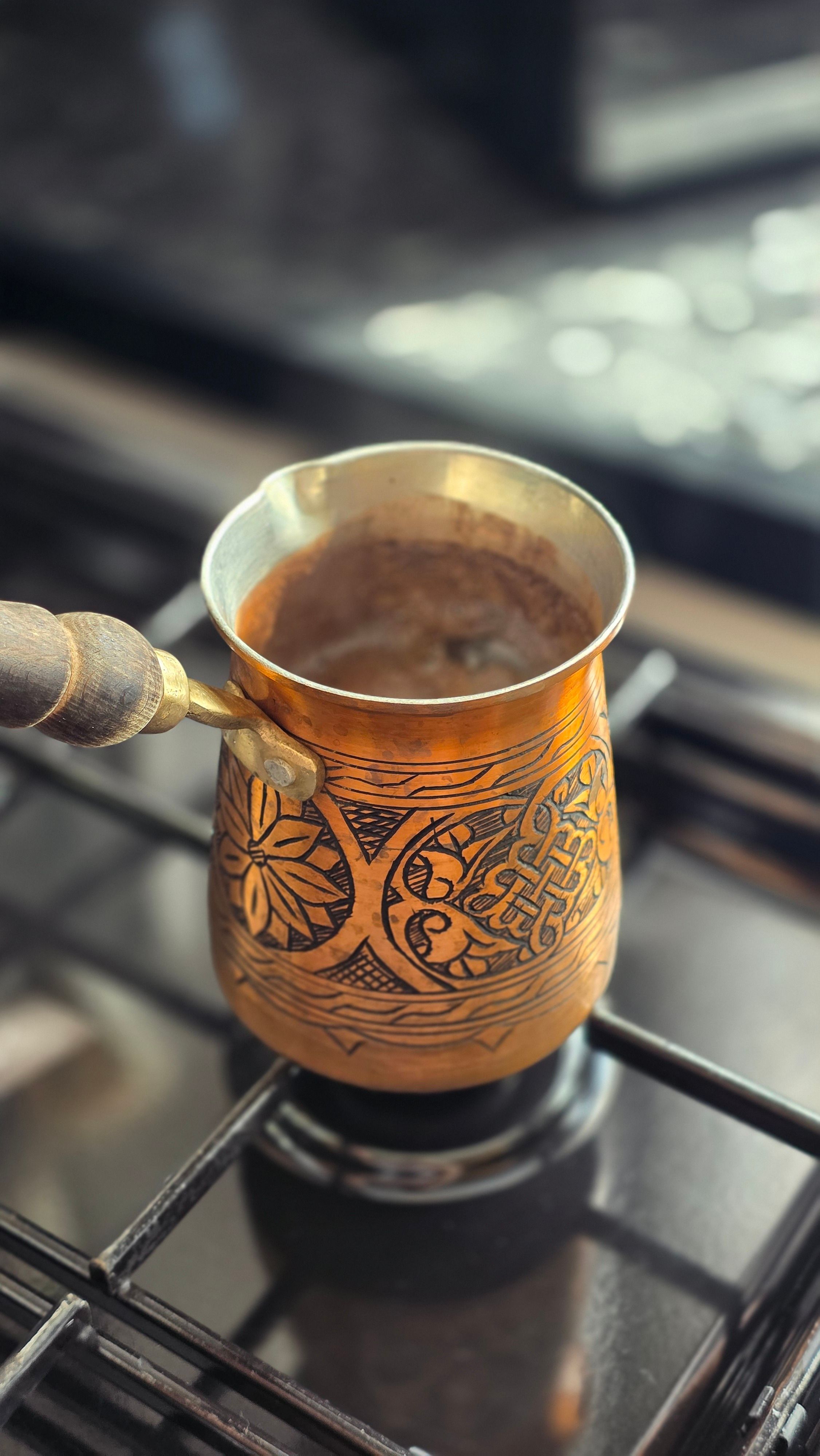 Traditional Brass Coffee Pot Brewing on Stove · Free Stock Photo