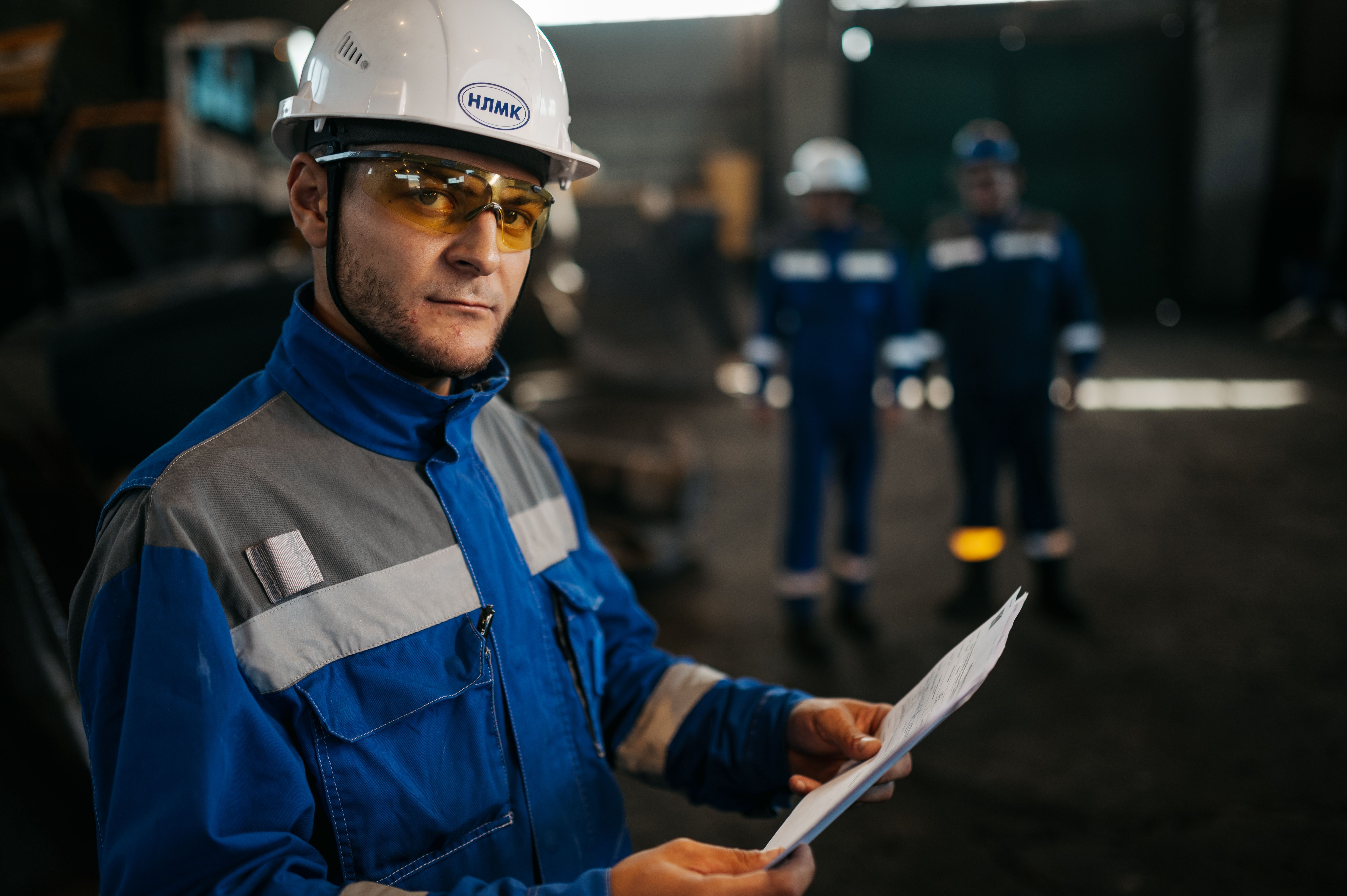 Man among People in Helmets · Free Stock Photo