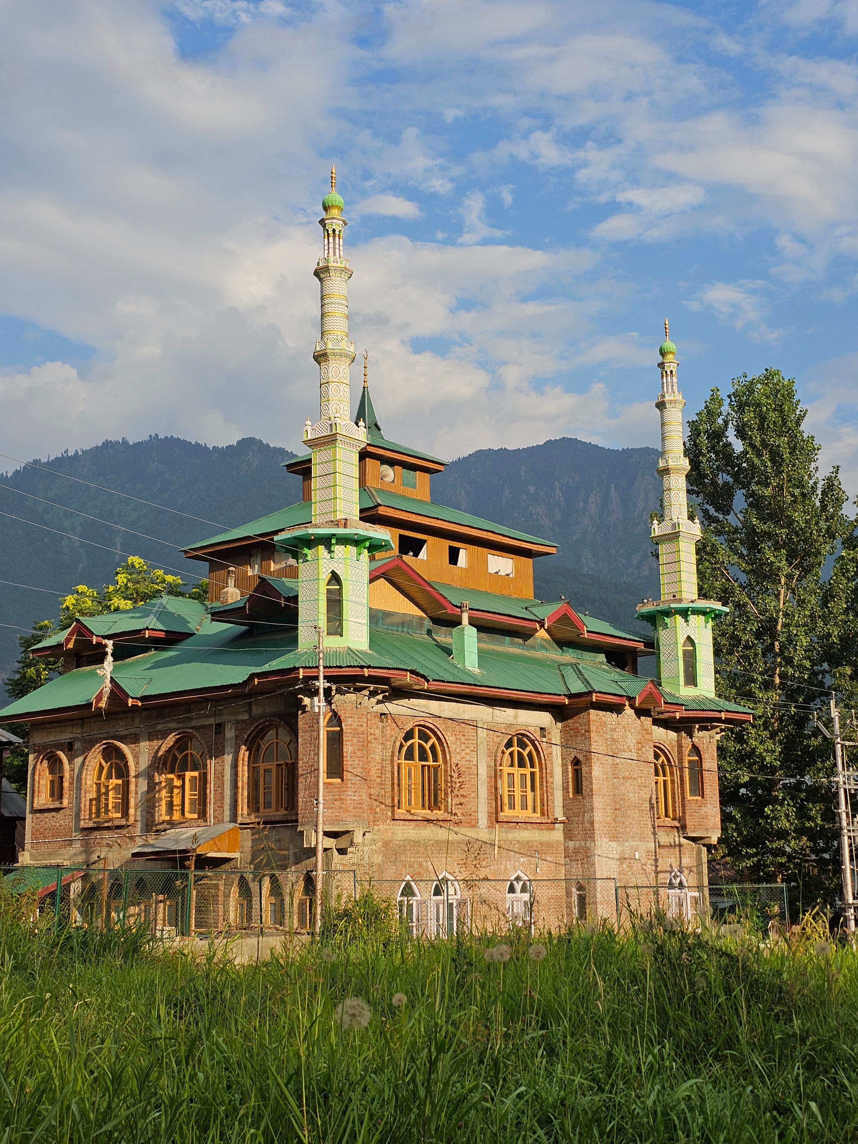 Scenic Mosque in Verdant Mountainous Landscape · Free Stock Photo