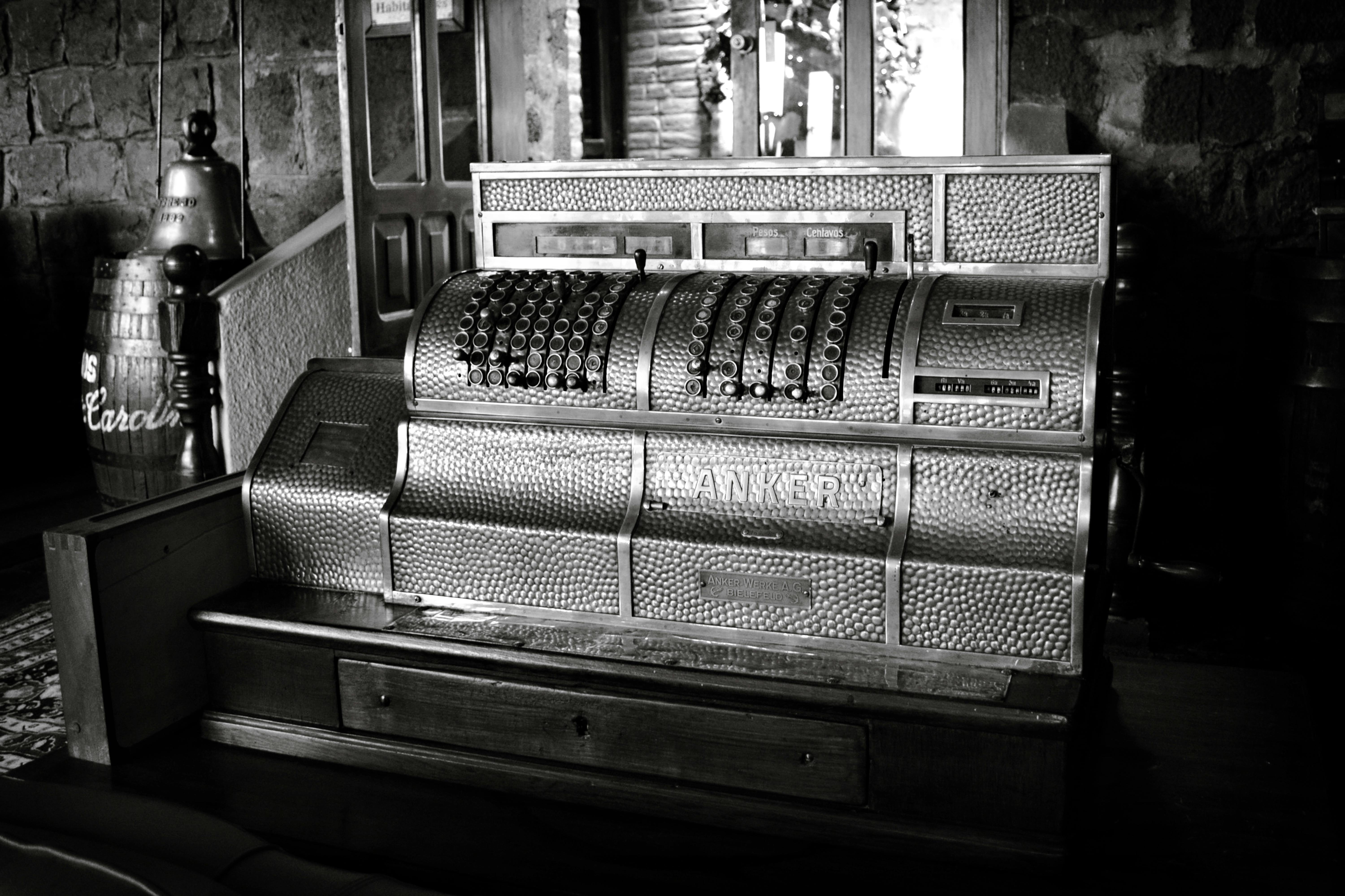 Vintage Anker Cash Register in Rustic Setting · Free Stock Photo