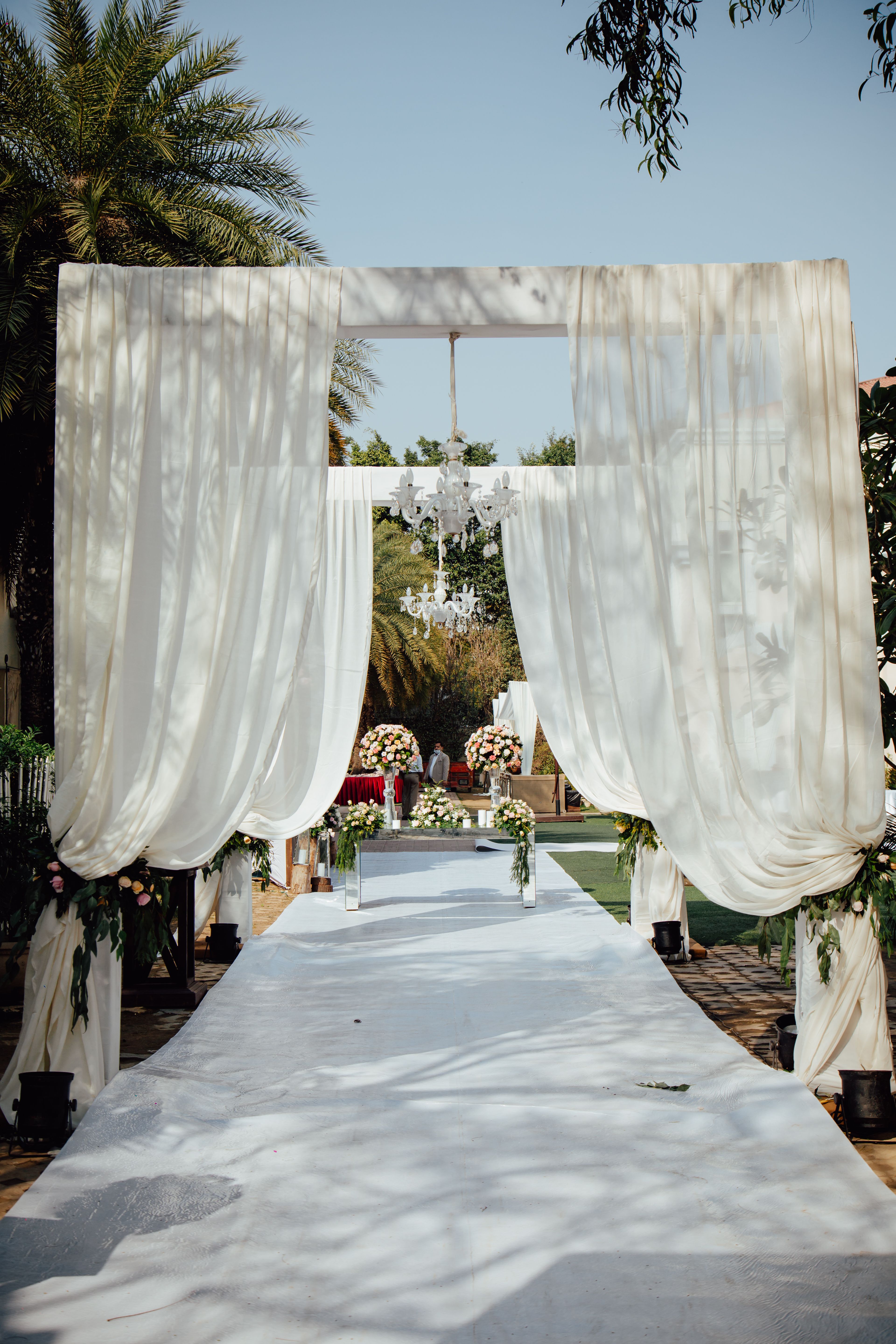 Elegant Outdoor Wedding Ceremony Setup in Garden · Free Stock Photo
