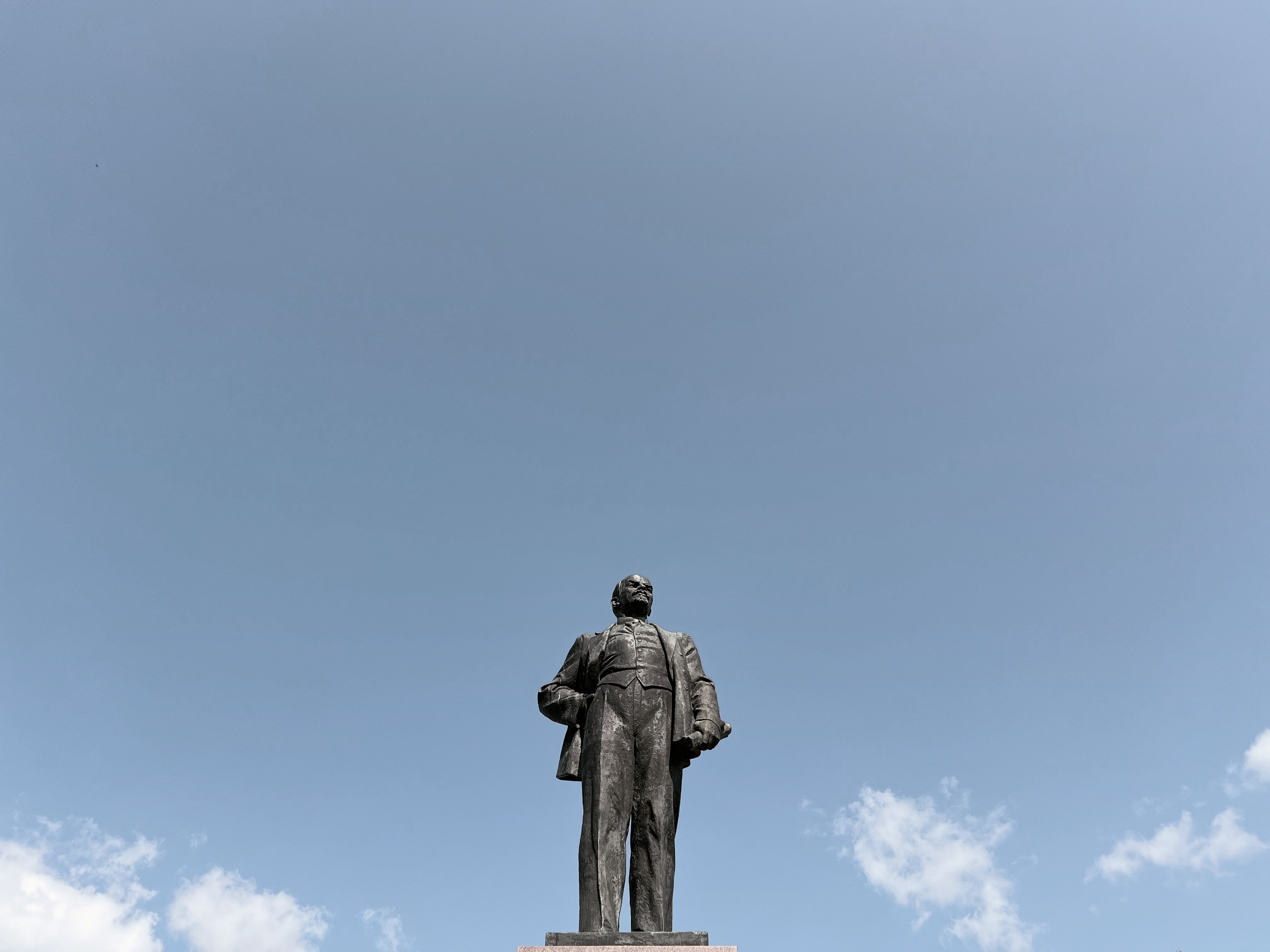Imposing Statue of Historical Figure against Blue Sky · Free Stock Photo