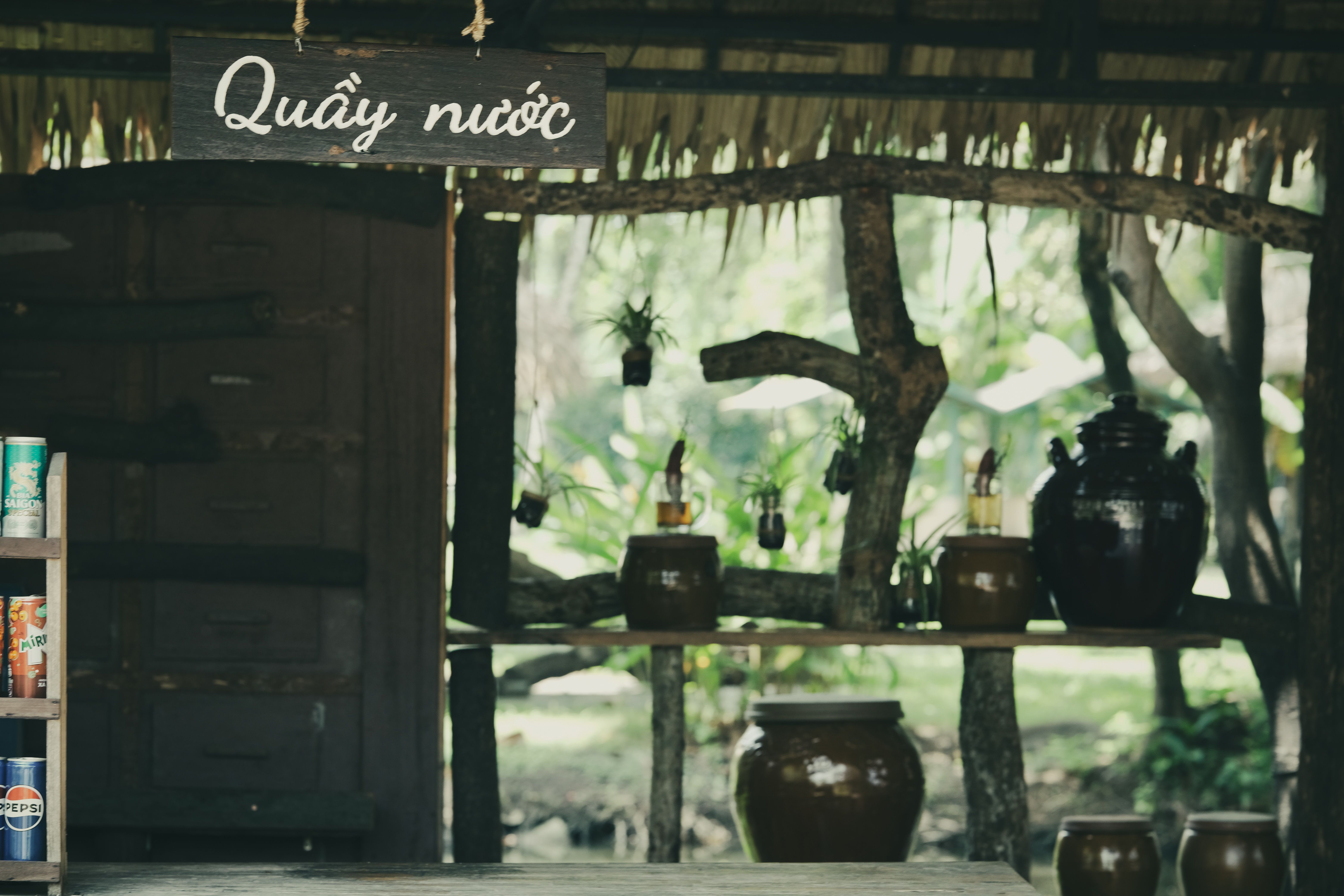 Rustic Beverage Stall with Clay Pots and Signage · Free Stock Photo