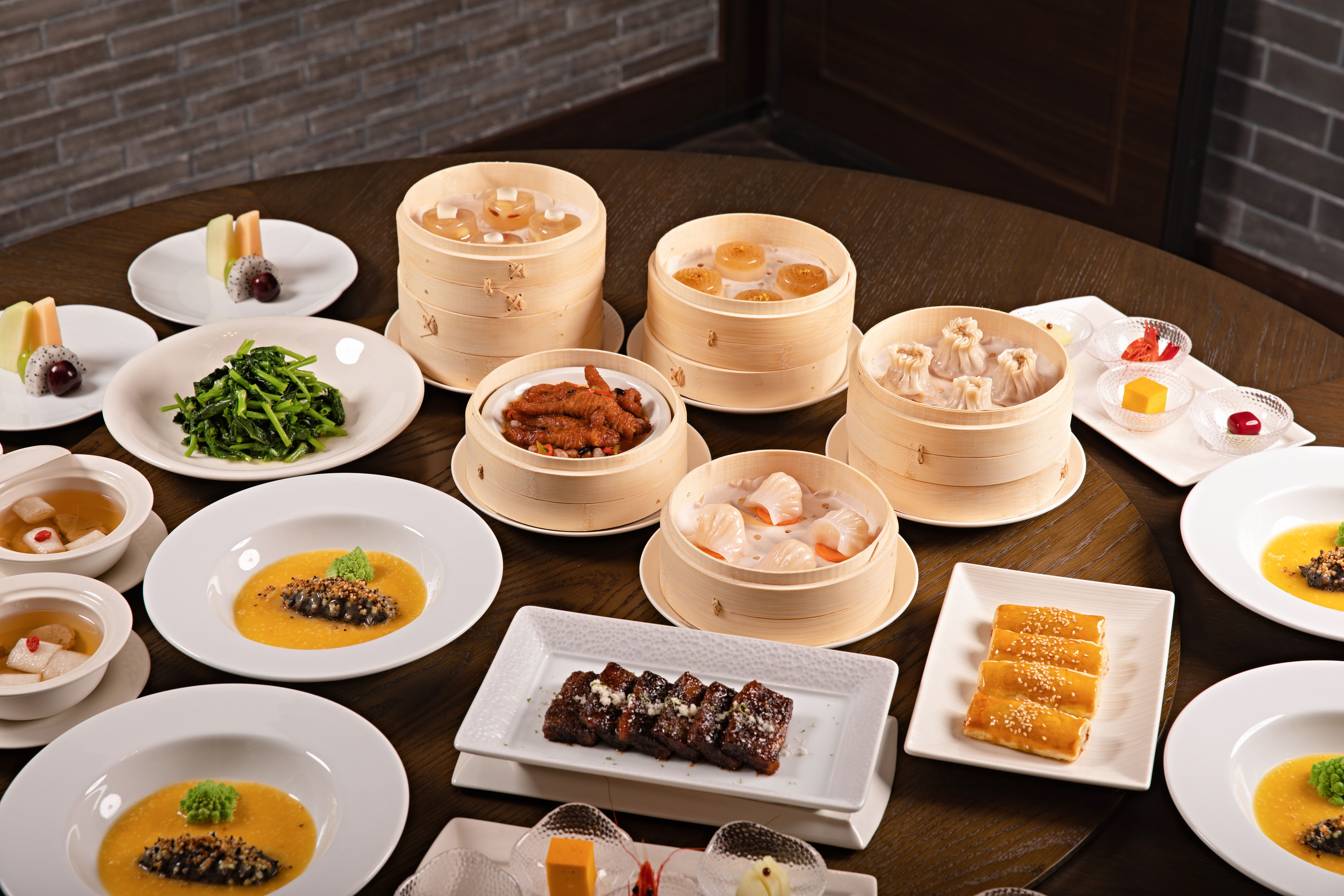 Elegant Dim Sum Assortment on Traditional Table · Free Stock Photo
