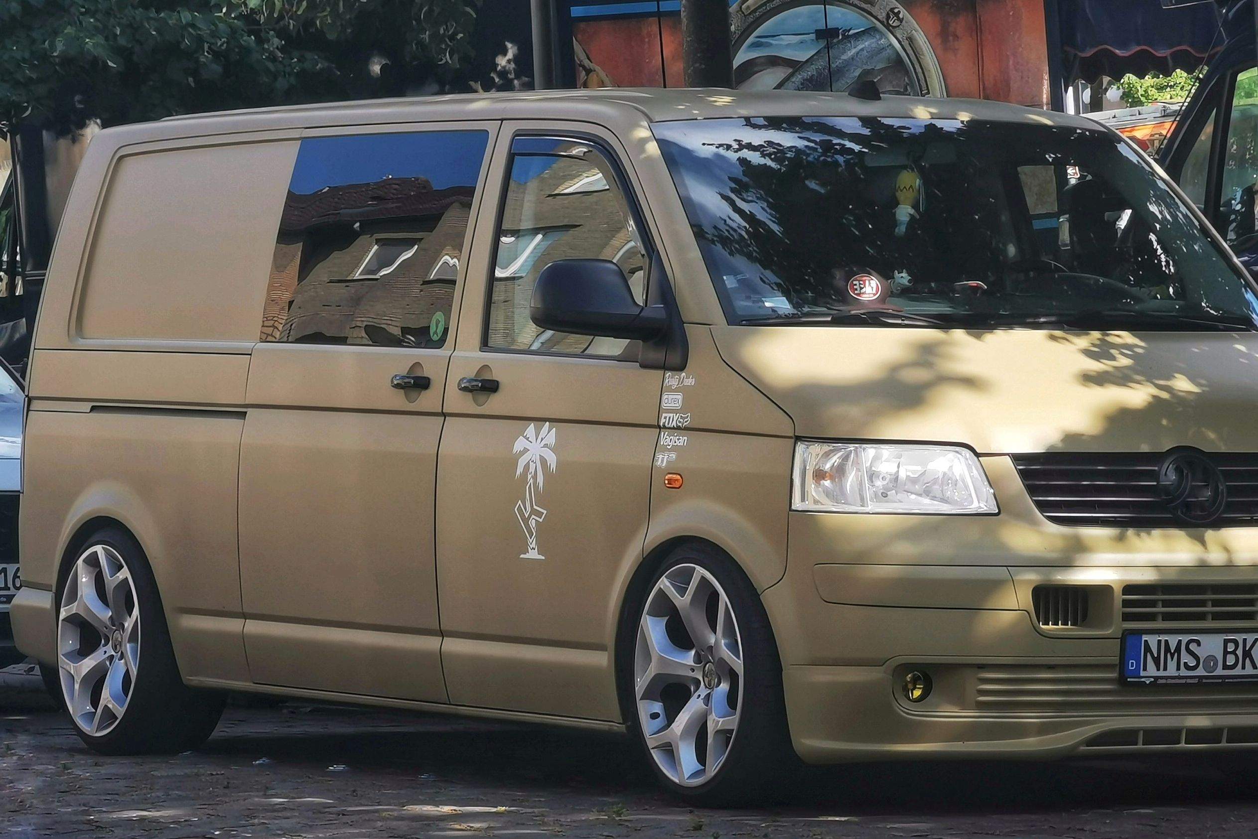 Modified Camper Van in Urban Parking Lot · Free Stock Photo