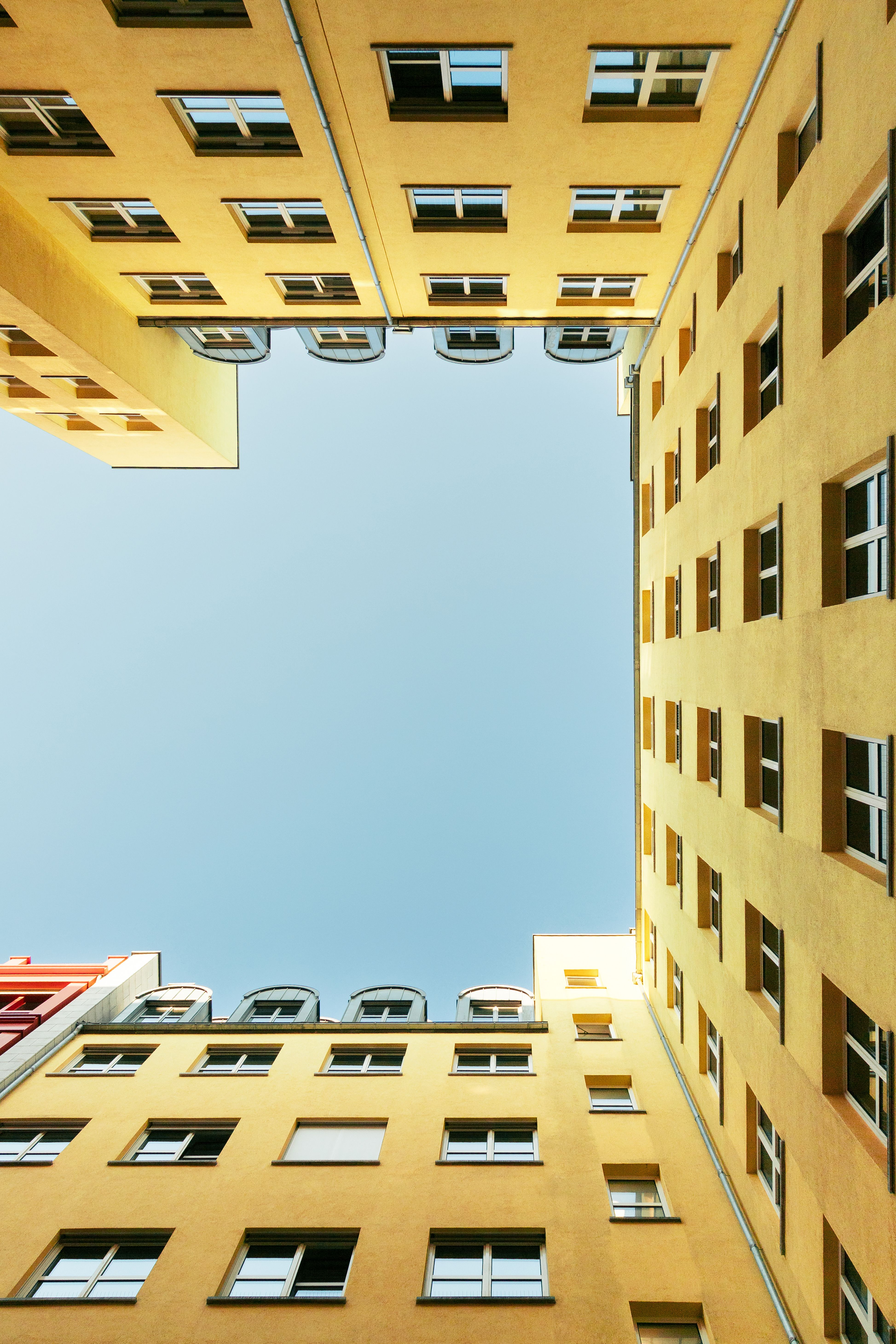 Upward View of Symmetrical Yellow Berlin Architecture · Free Stock Photo