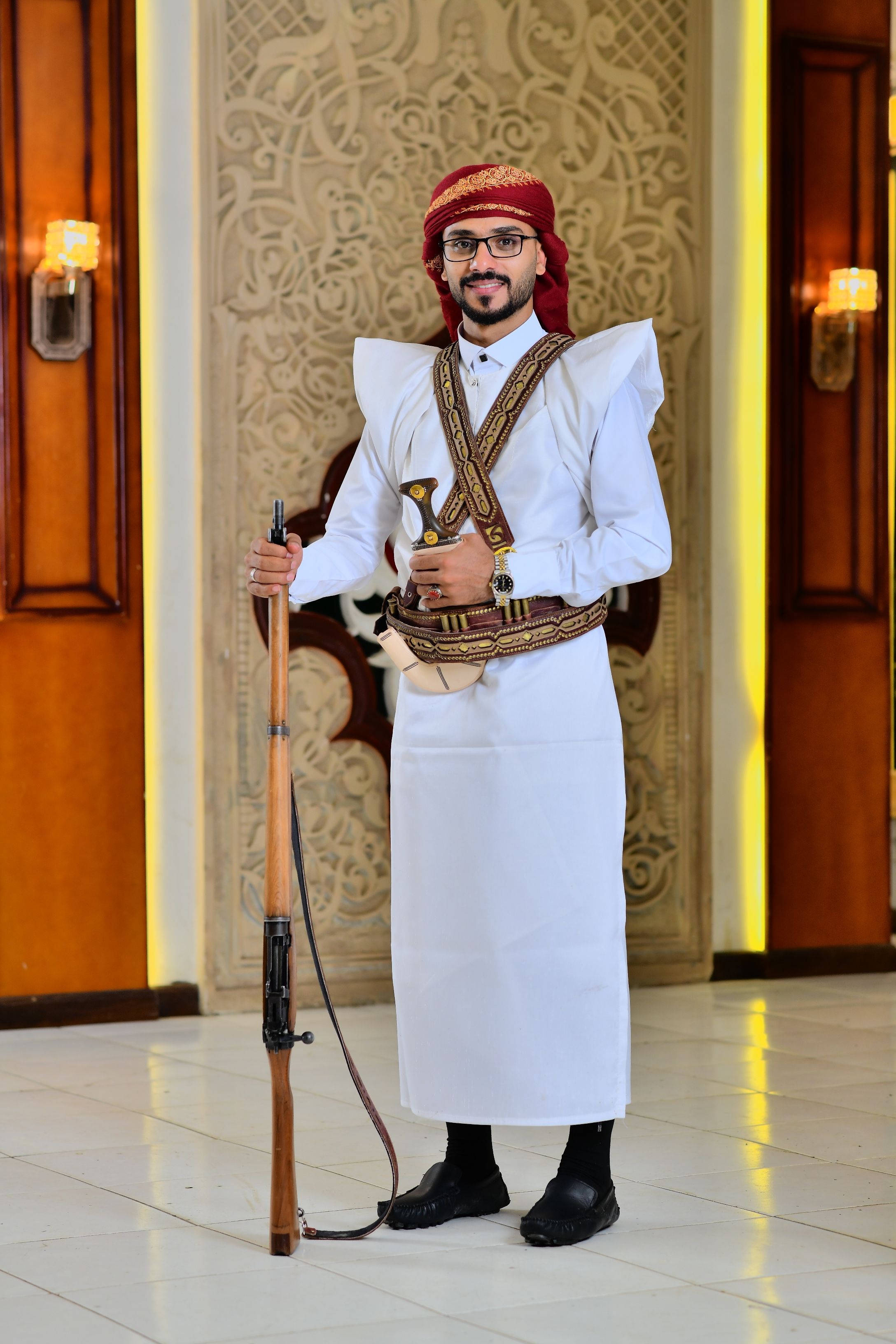 Traditional Yemeni Attire with Jambiya and Rifle · Free Stock Photo
