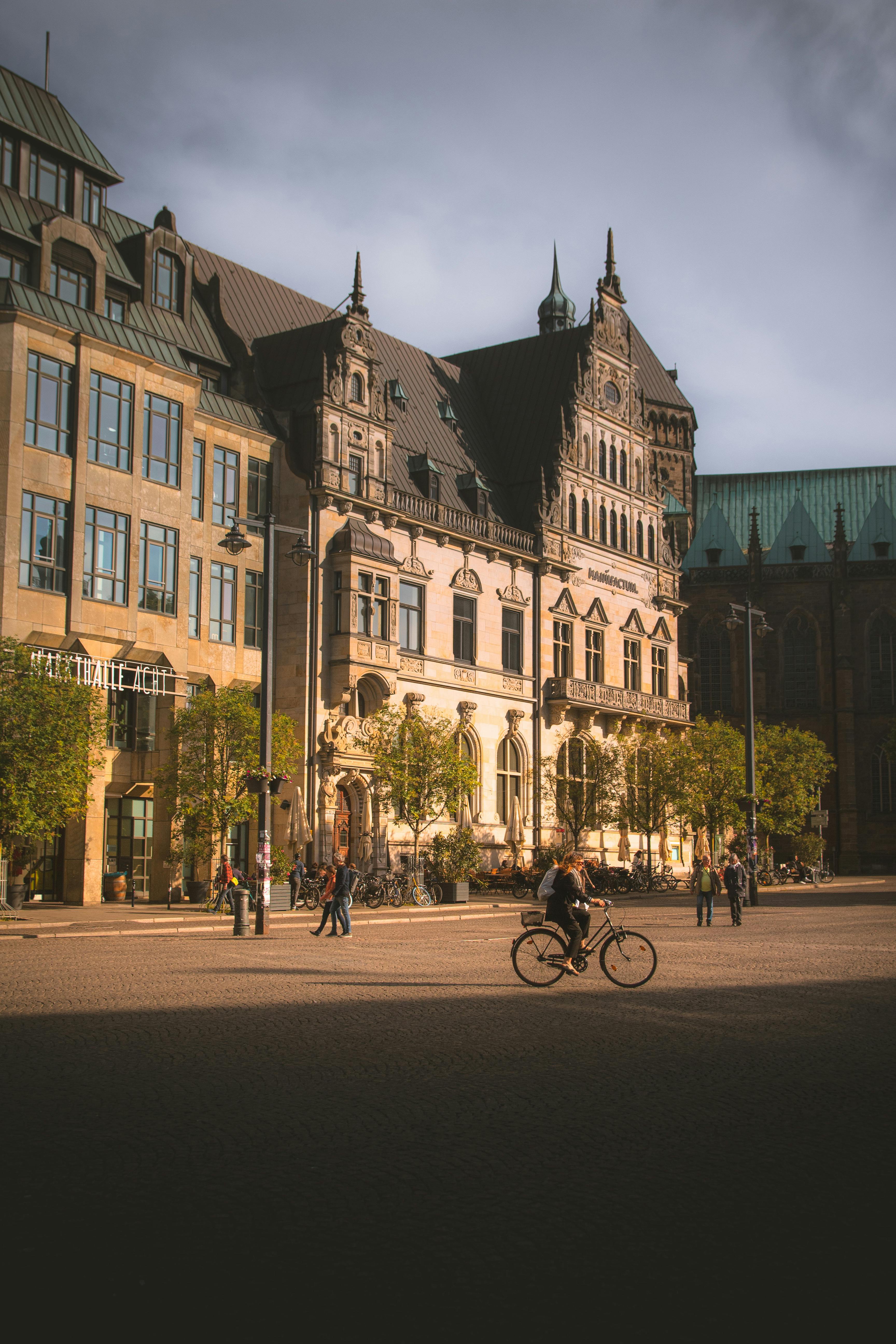 Historic European Building in Sunlit City Square · Free Stock Photo