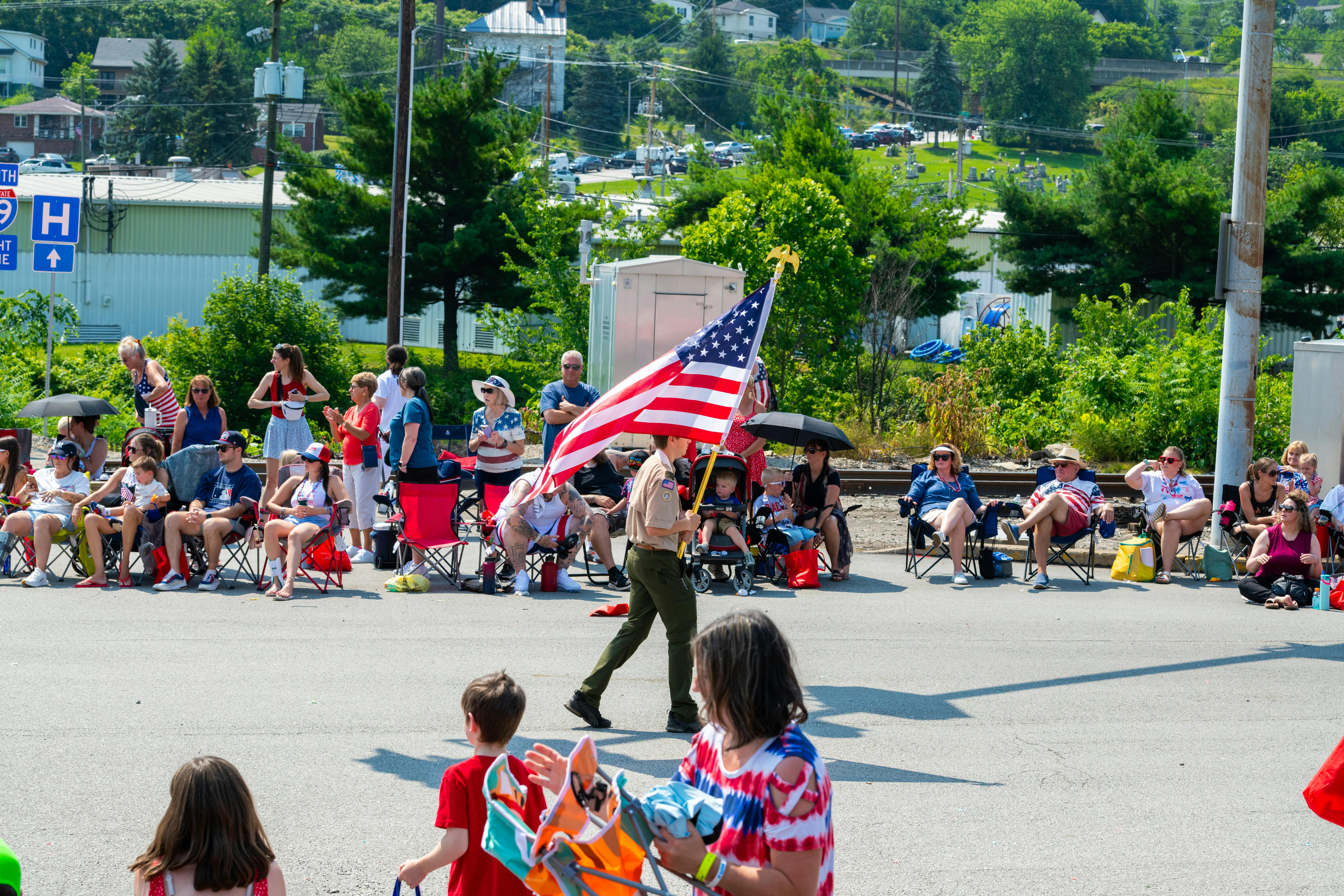 Boy Scout Marching with American Flag at Parade · Free Stock Photo