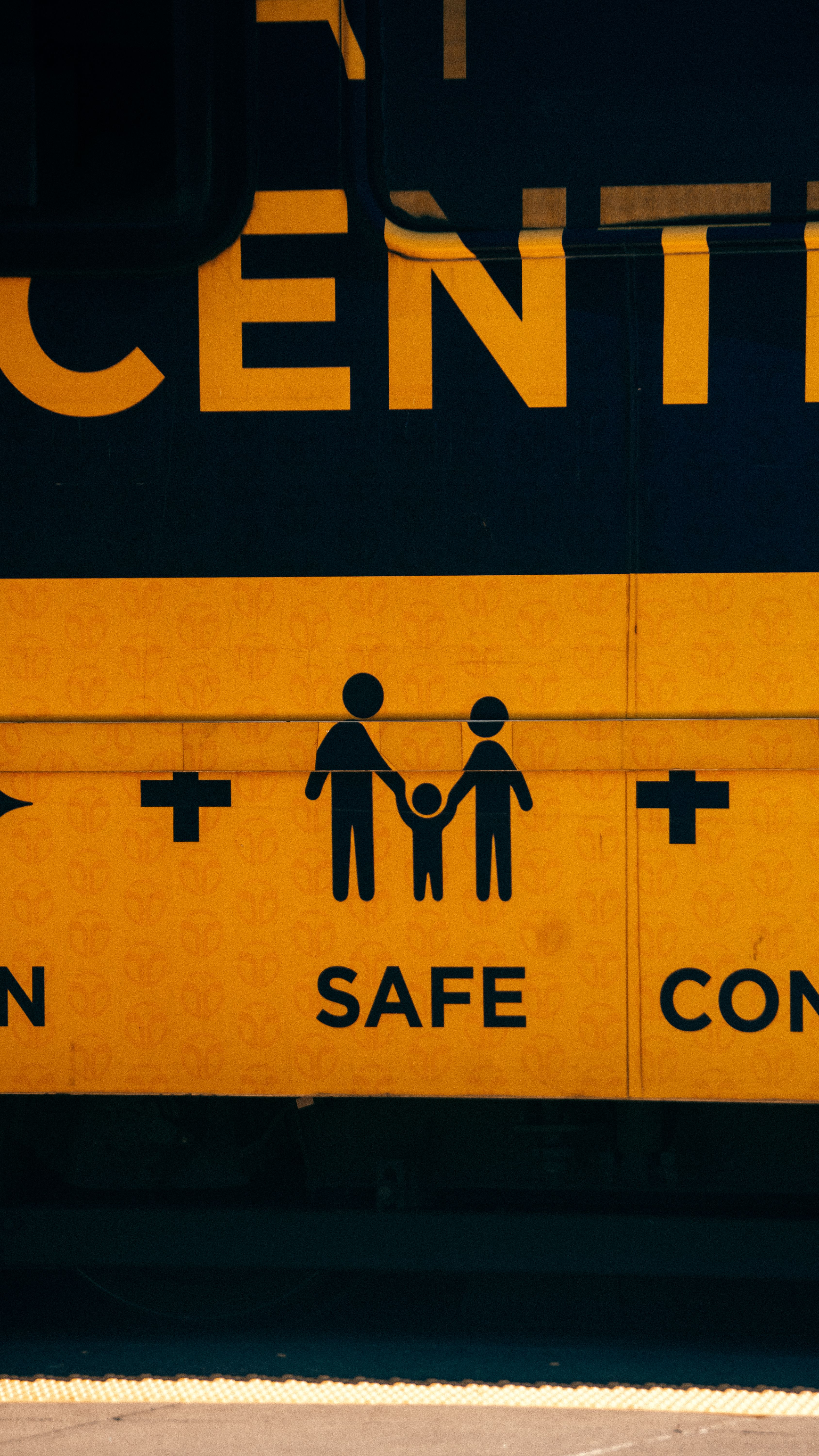 Safety Sign with Family Icon on Yellow Background · Free Stock Photo