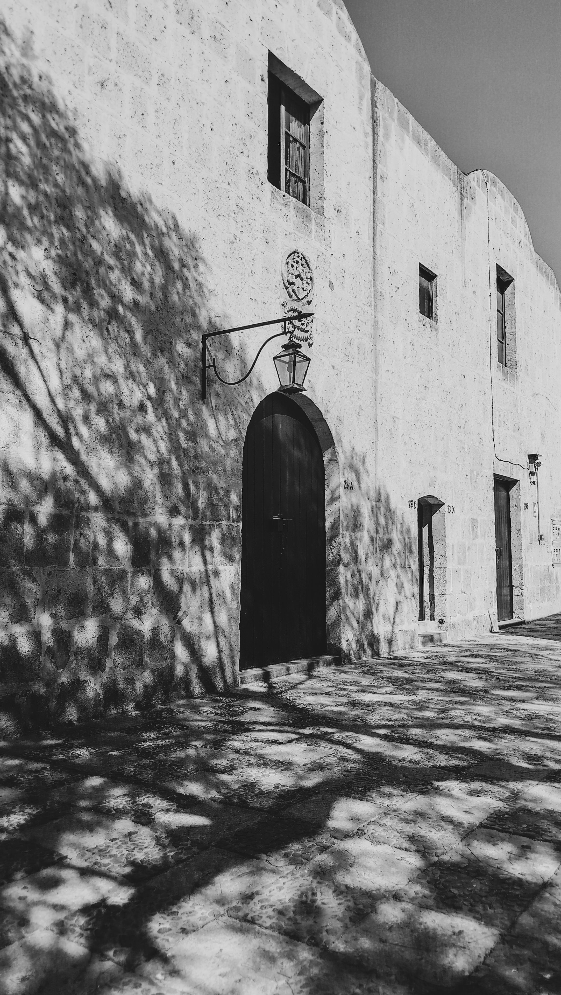 Historic Stone Building with Dramatic Shadows · Free Stock Photo