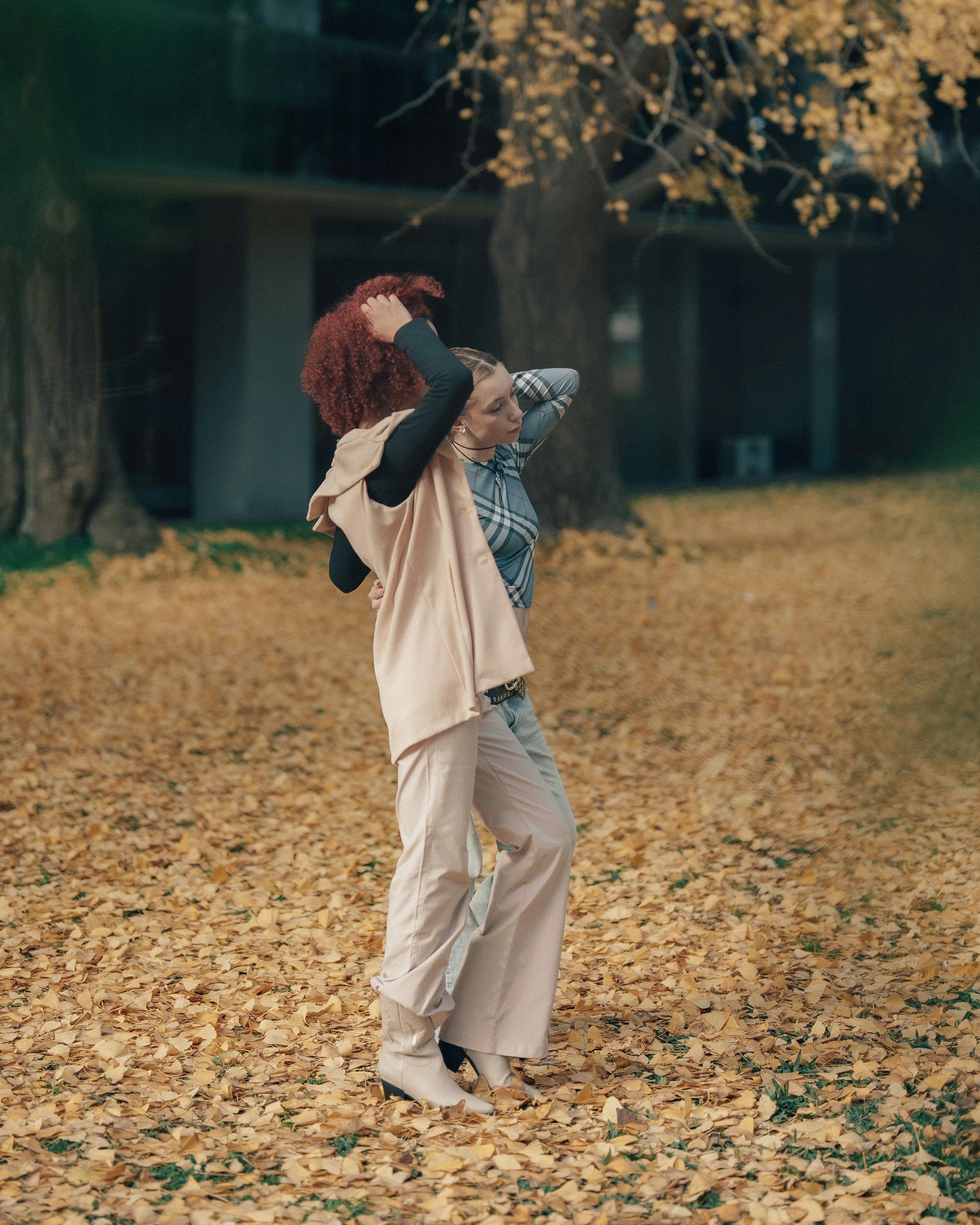 Autumn Dance in Leaf-Covered Buenos Aires Park · Free Stock Photo