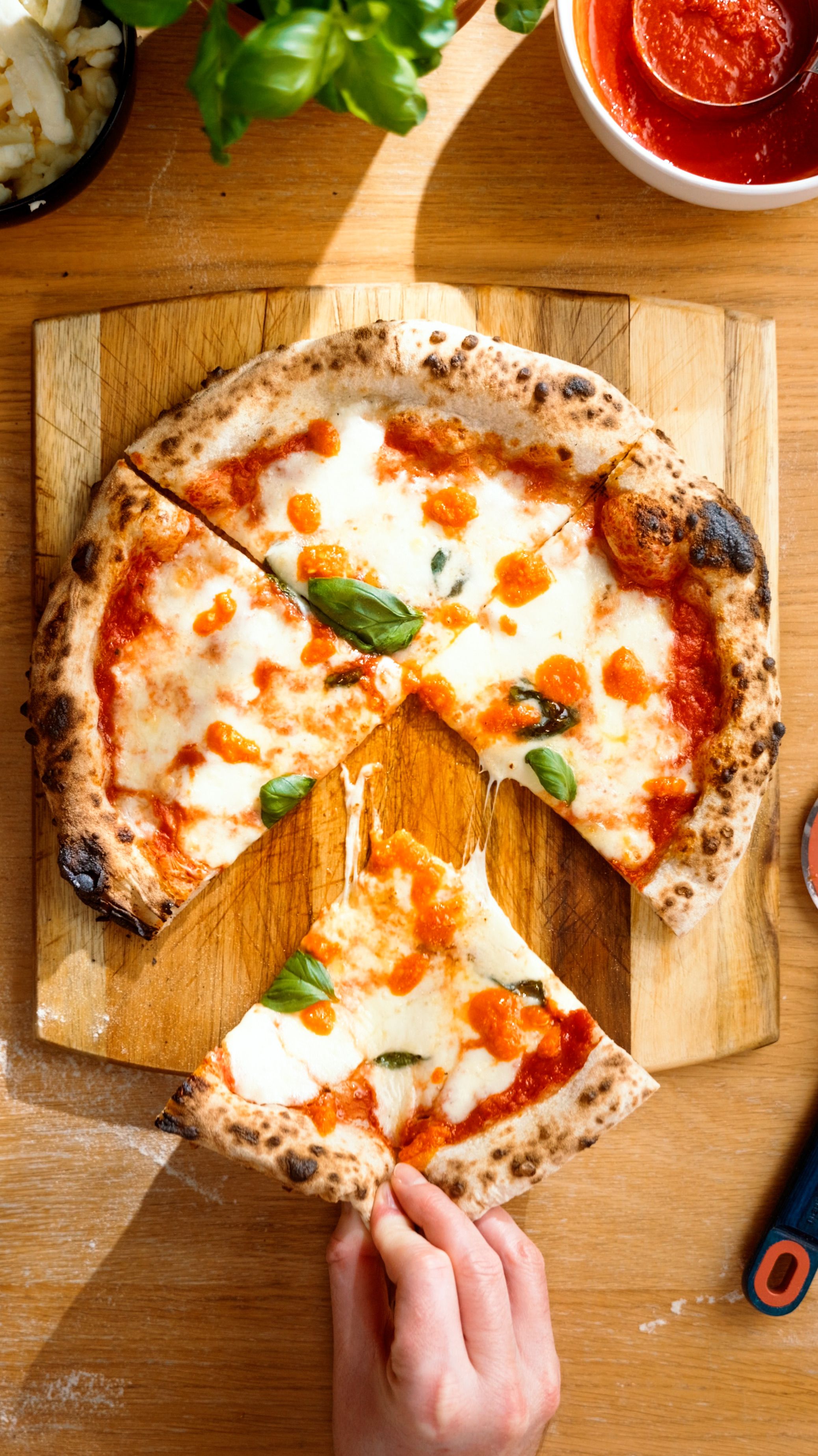 Fresh Margherita Pizza with Basil on Wooden Board · Free Stock Photo