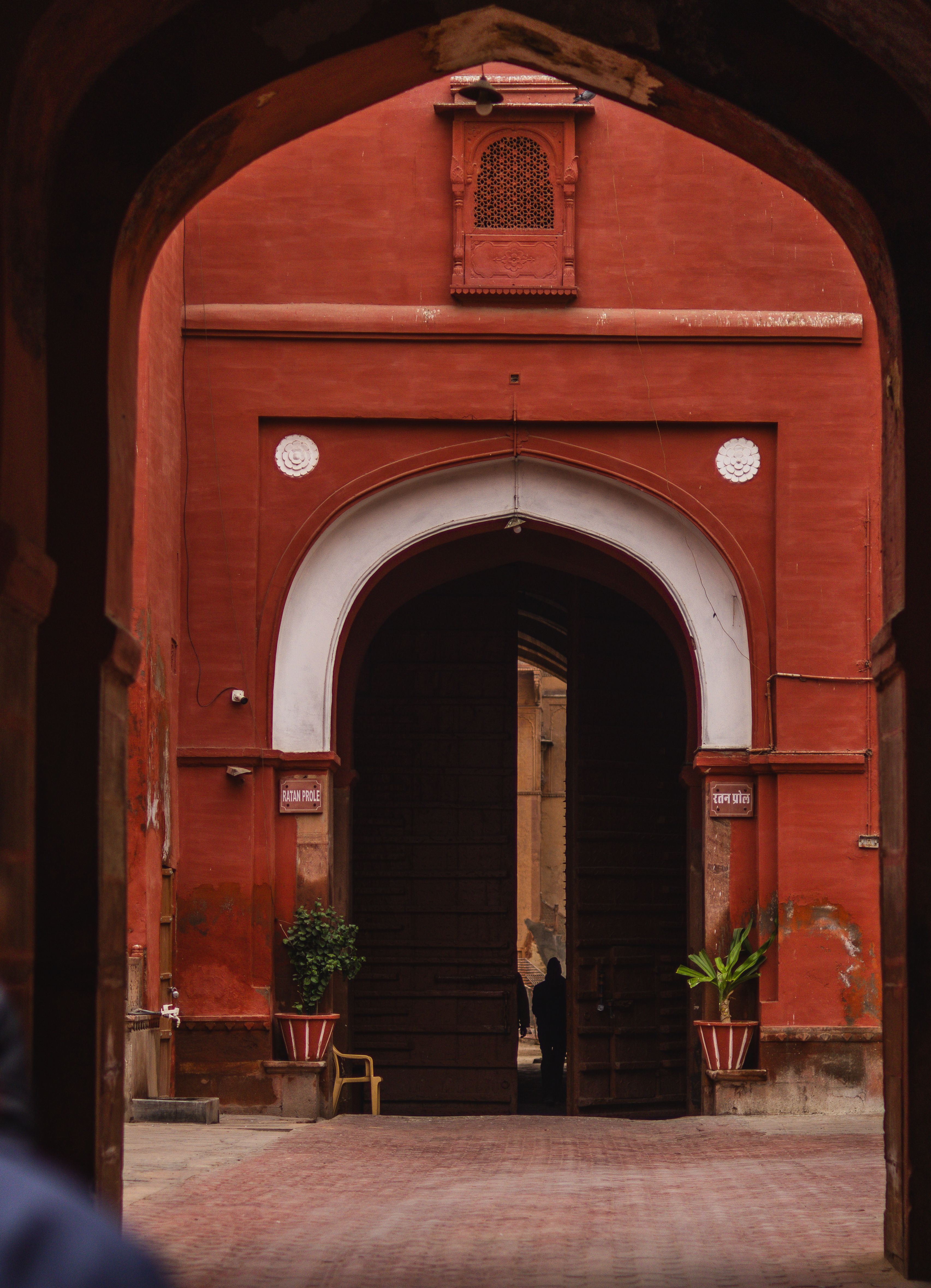 Historic Red Archway Leading to Courtyard · Free Stock Photo