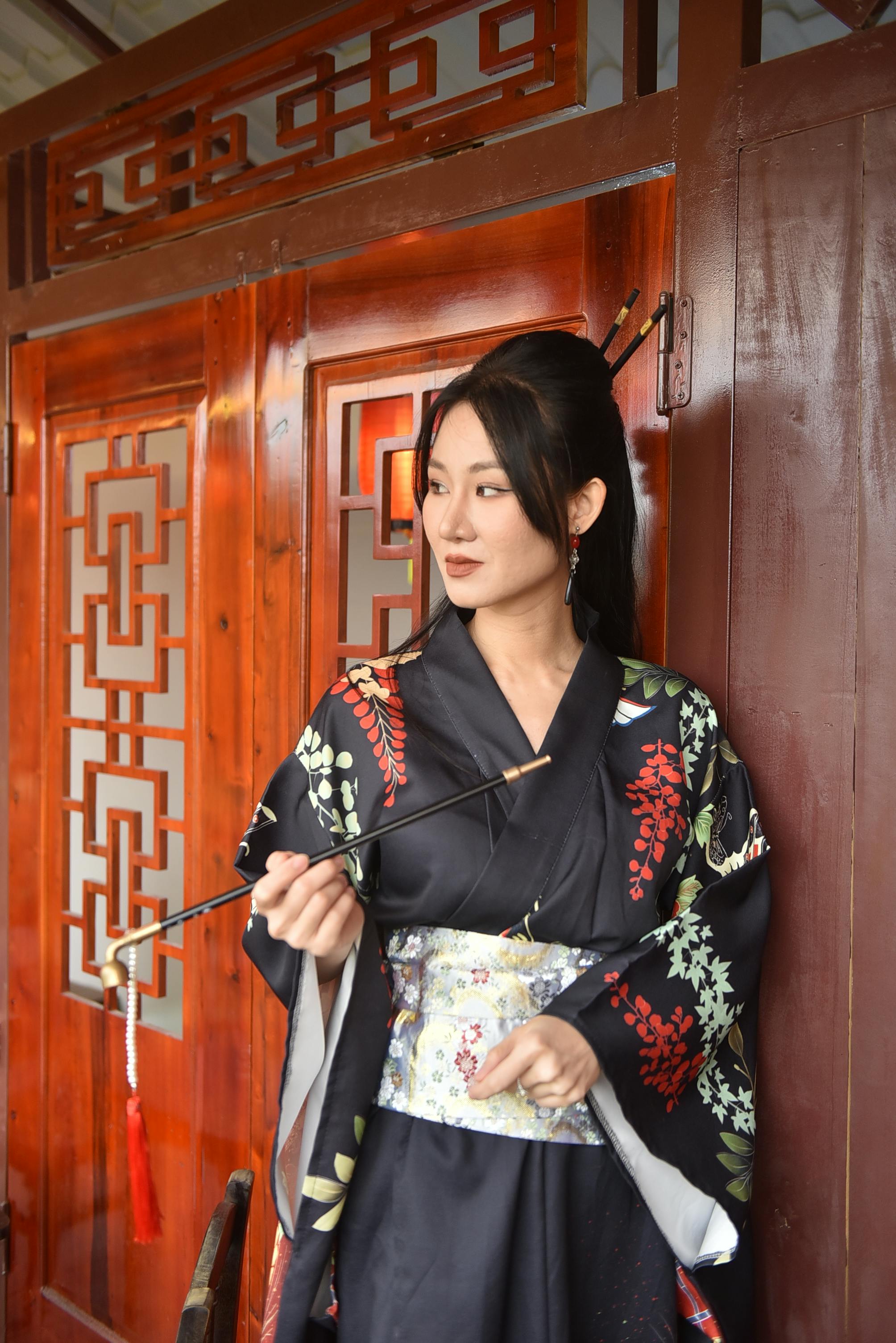 Woman in Traditional Dress Standing by Storefront · Free Stock Photo