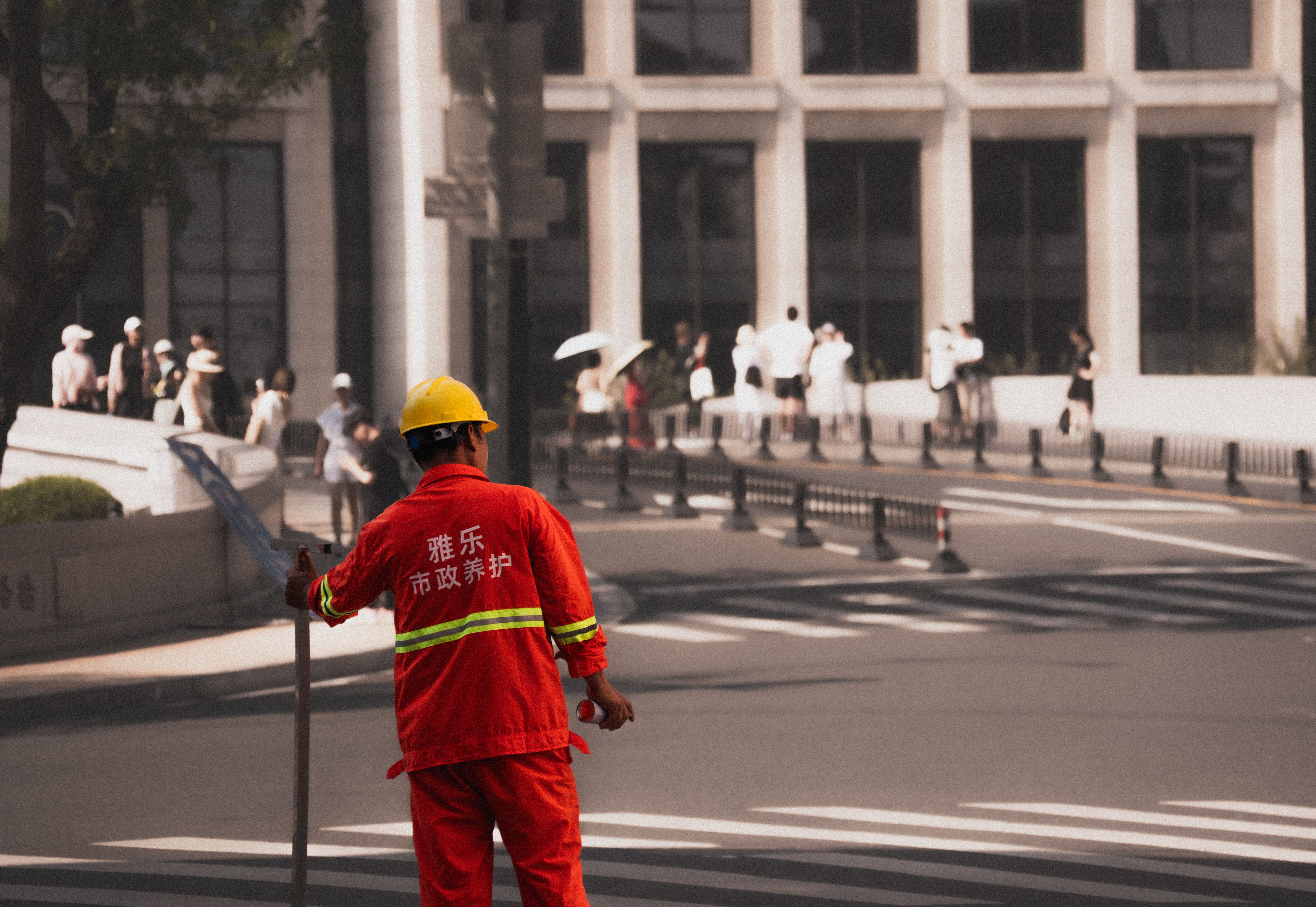 Urban worker managing street traffic in city · Free Stock Photo