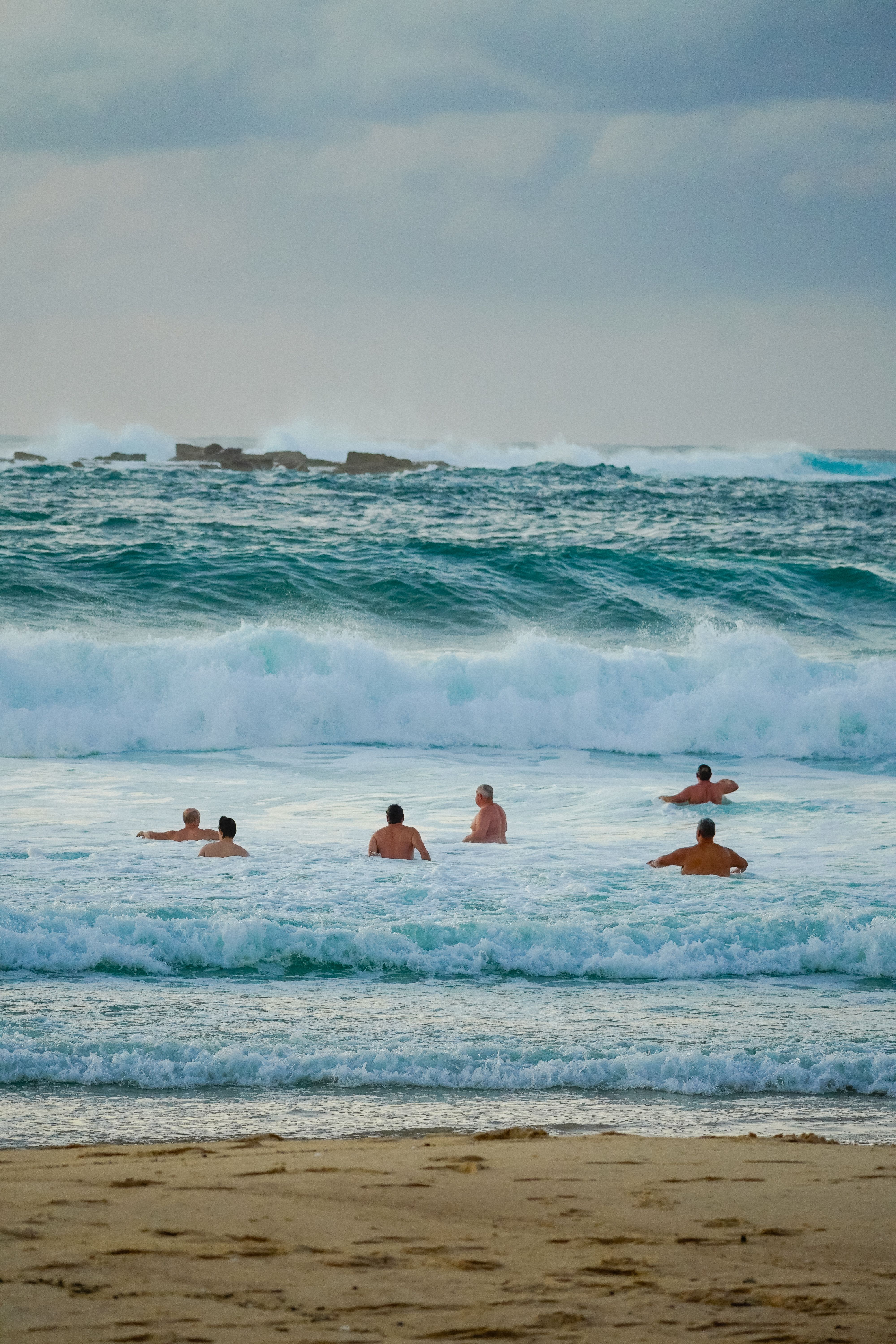 Group of People Swimming in Ocean Waves · Free Stock Photo