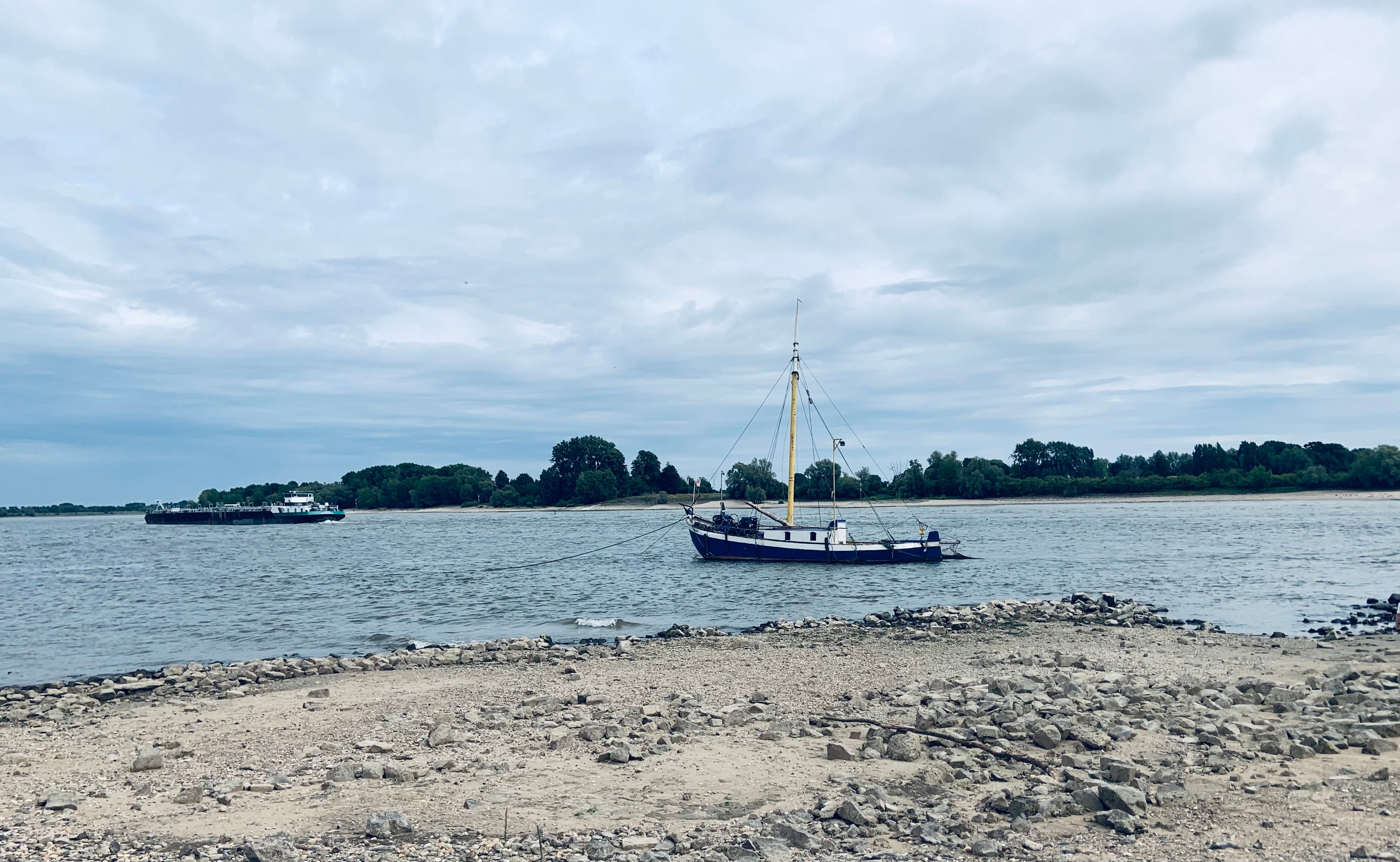 Serene View of River and Boat in Rees, Germany · Free Stock Photo