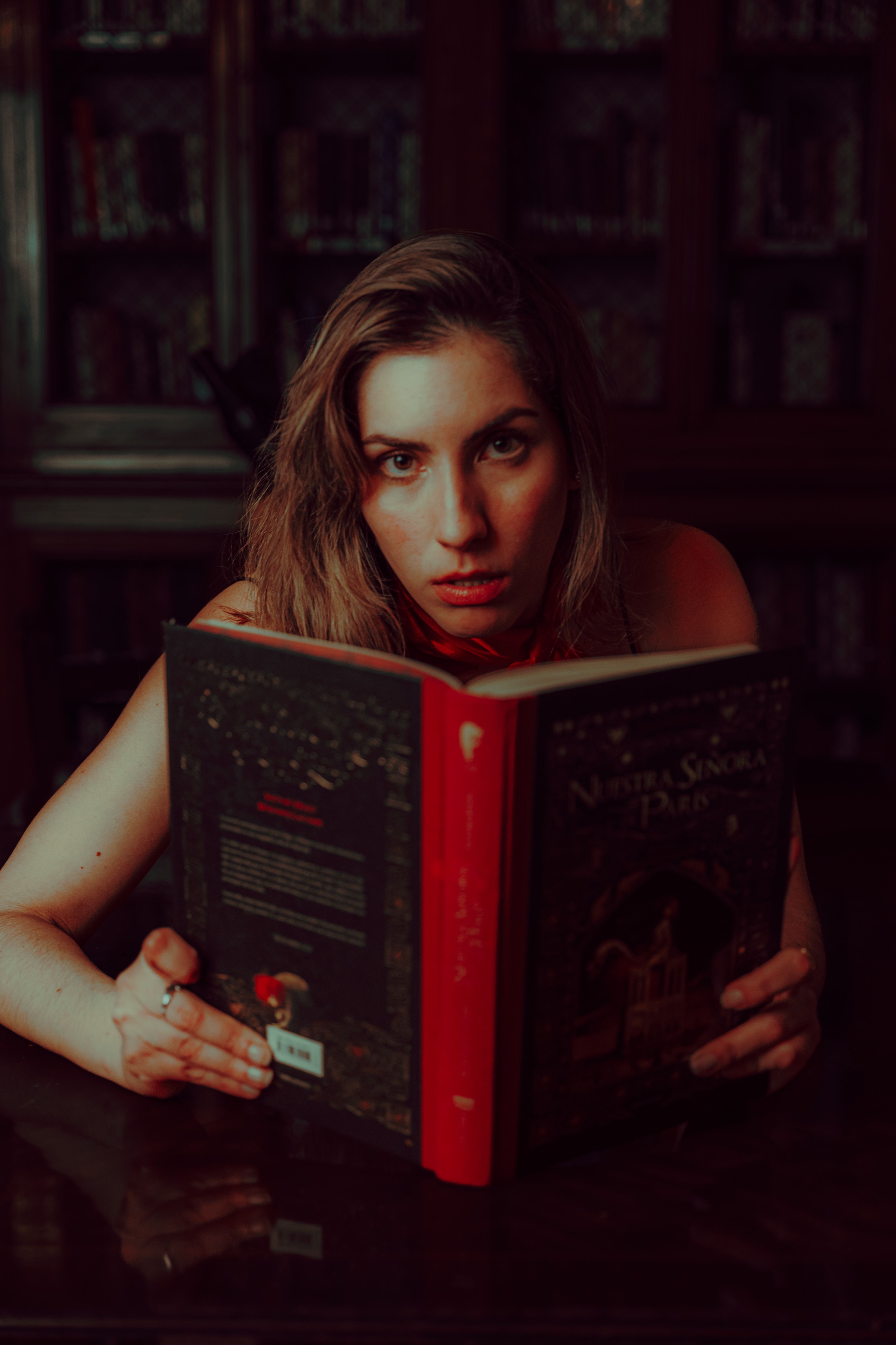 Woman immersed in a captivating book · Free Stock Photo