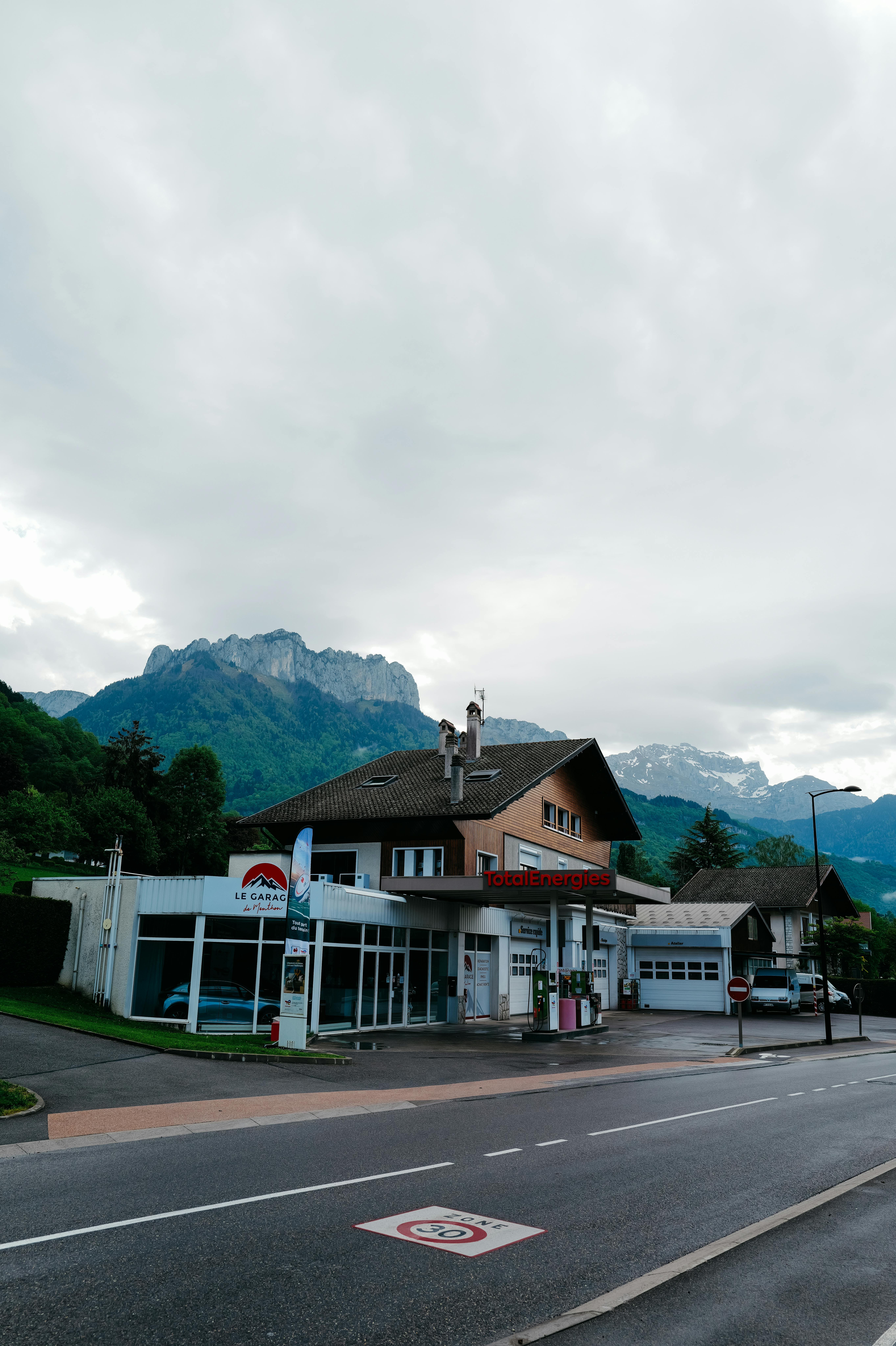 Charming Alpine Gas Station in Scenic Mountain Setting · Free Stock Photo