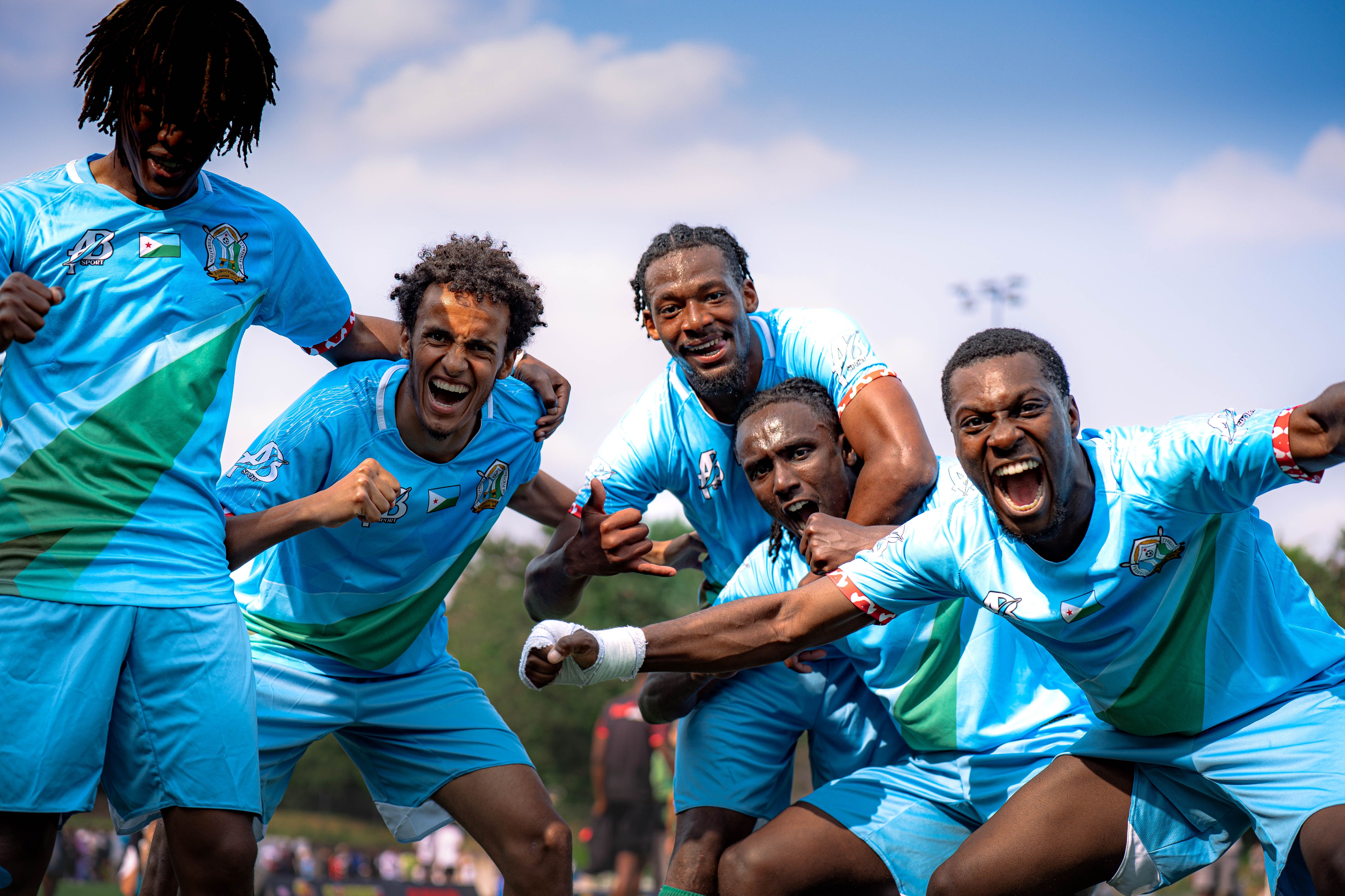 Joyful Soccer Team Celebrating a Victory · Free Stock Photo