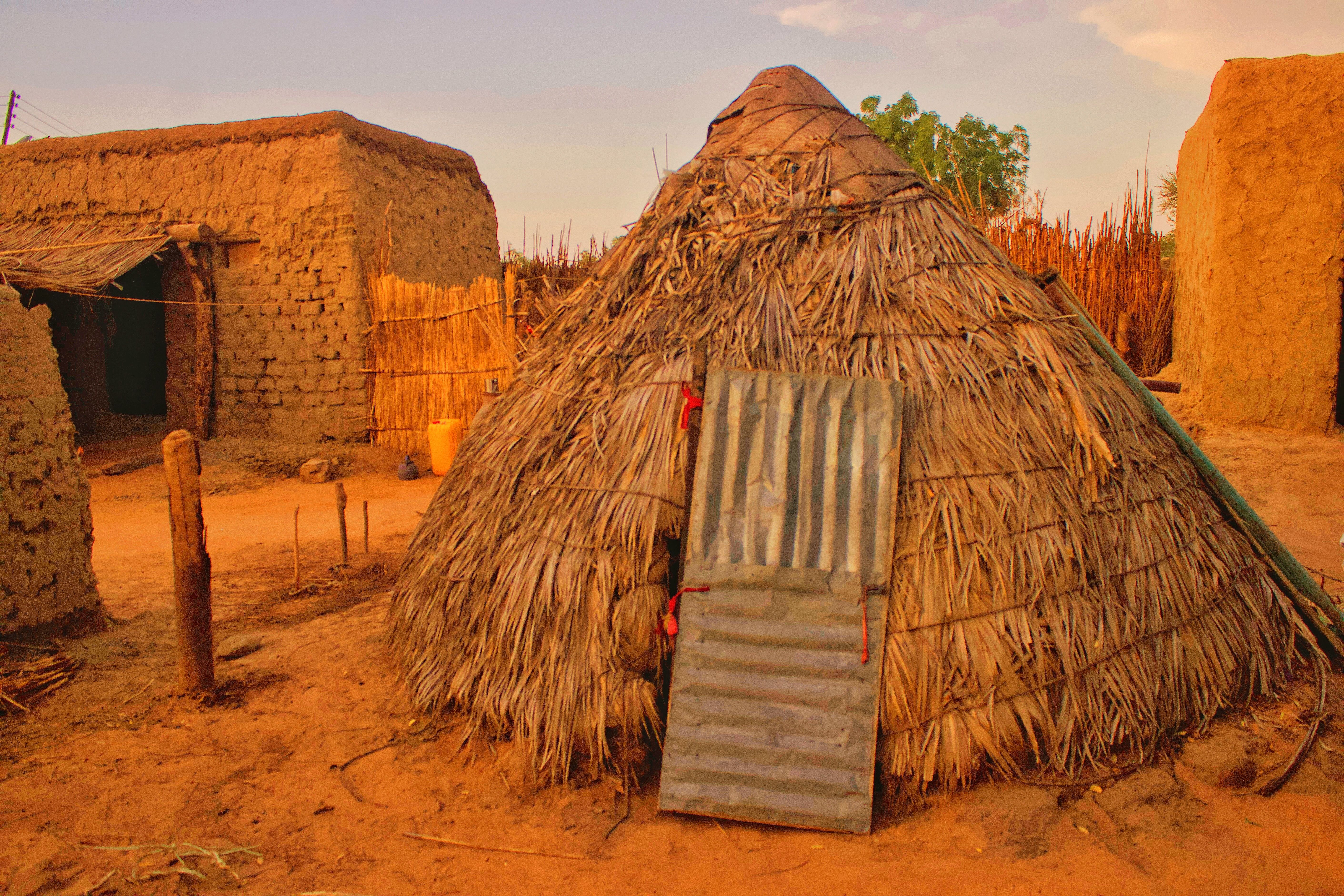 Traditional African Hut in Rural Village Setting · Free Stock Photo