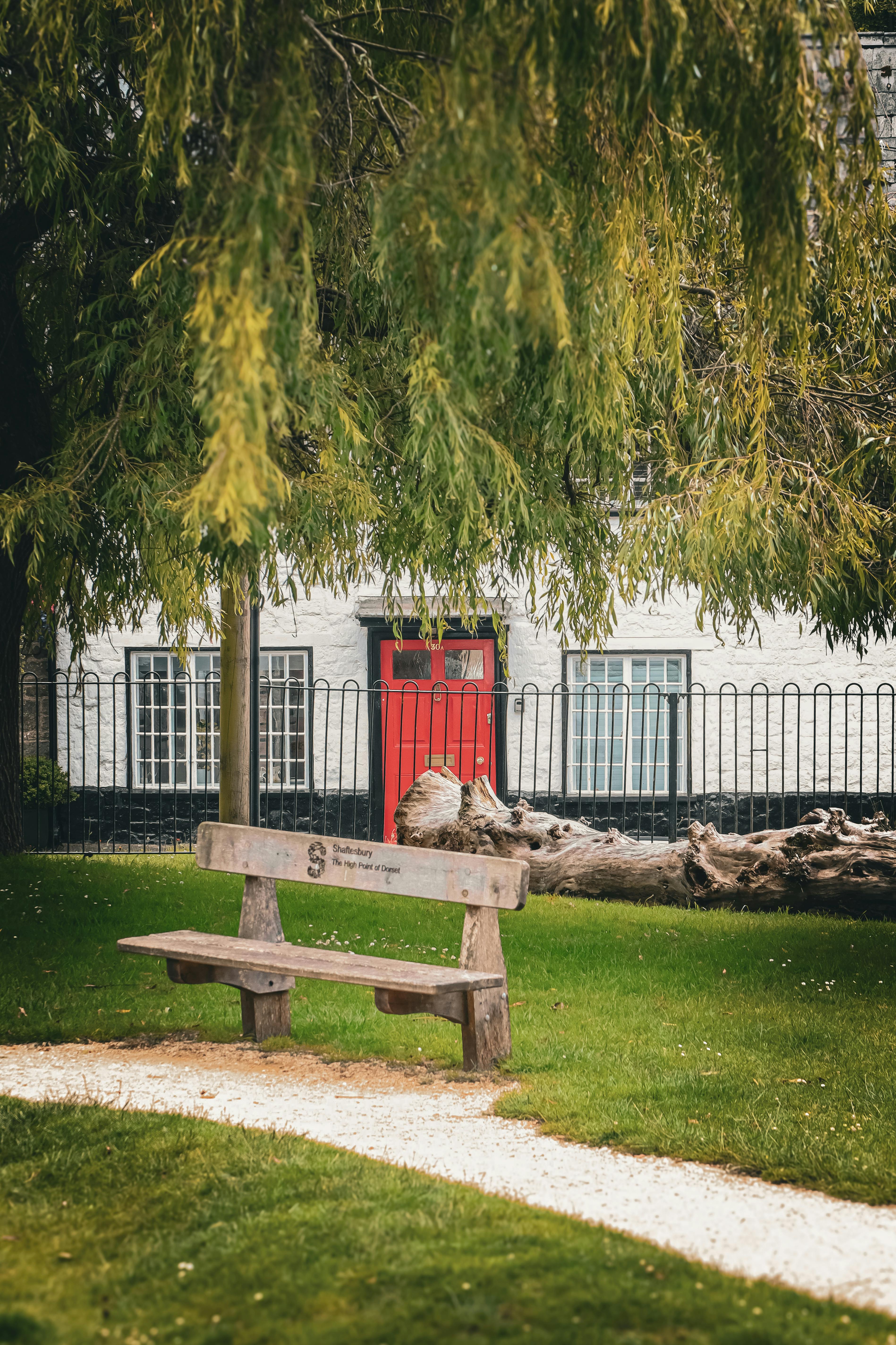 Quaint Garden with Red Door in Shaftesbury · Free Stock Photo
