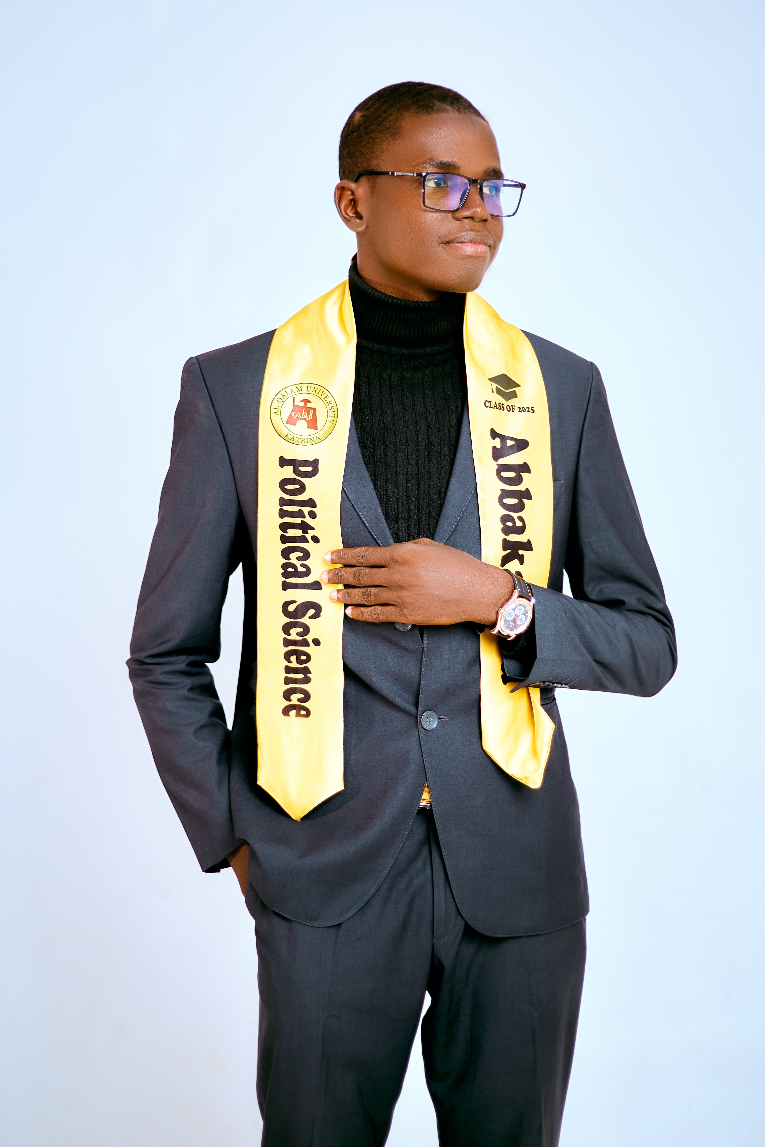 Young Graduate in Suit with Graduation Stole · Free Stock Photo
