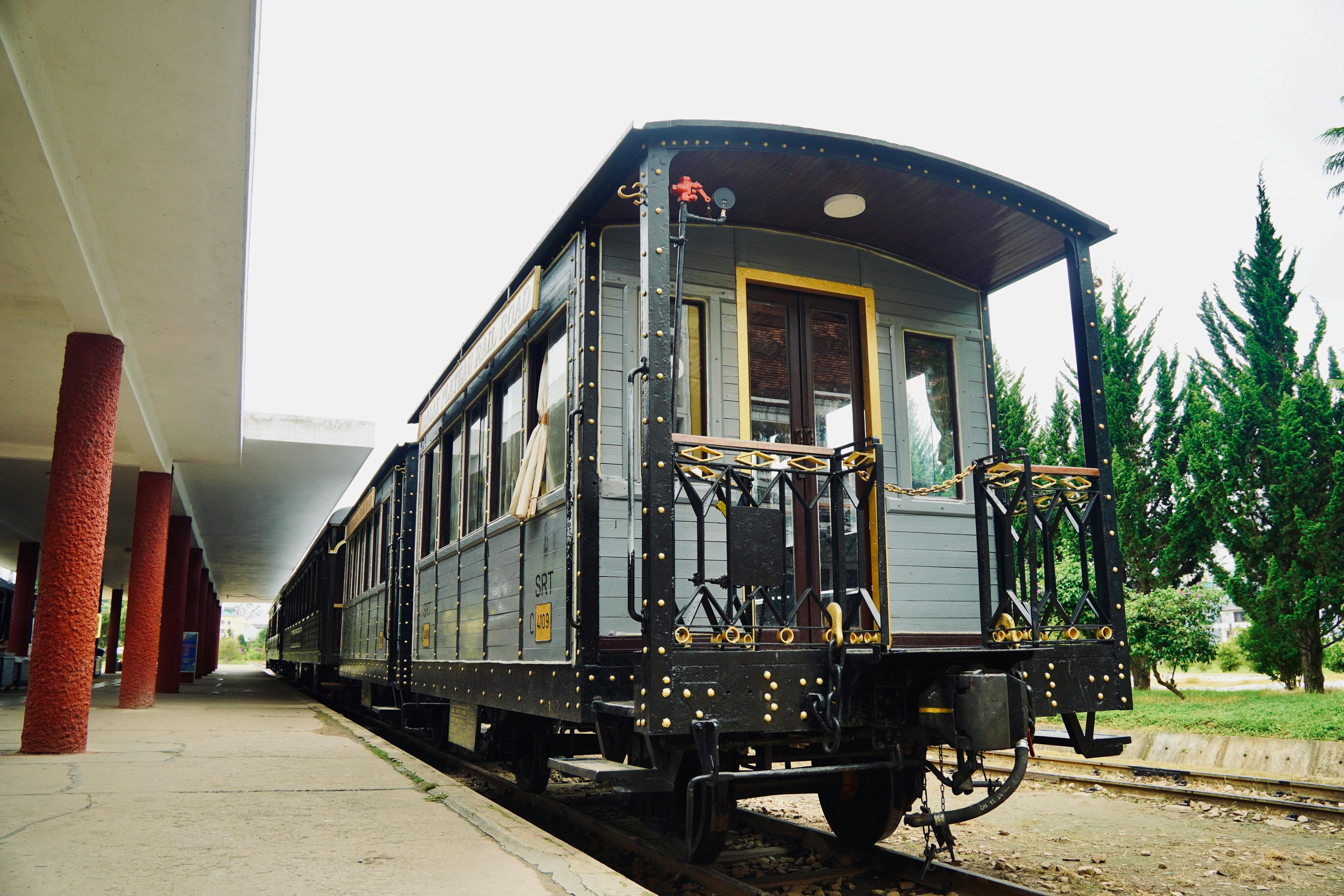 Vintage Train at Rustic Station Platform · Free Stock Photo