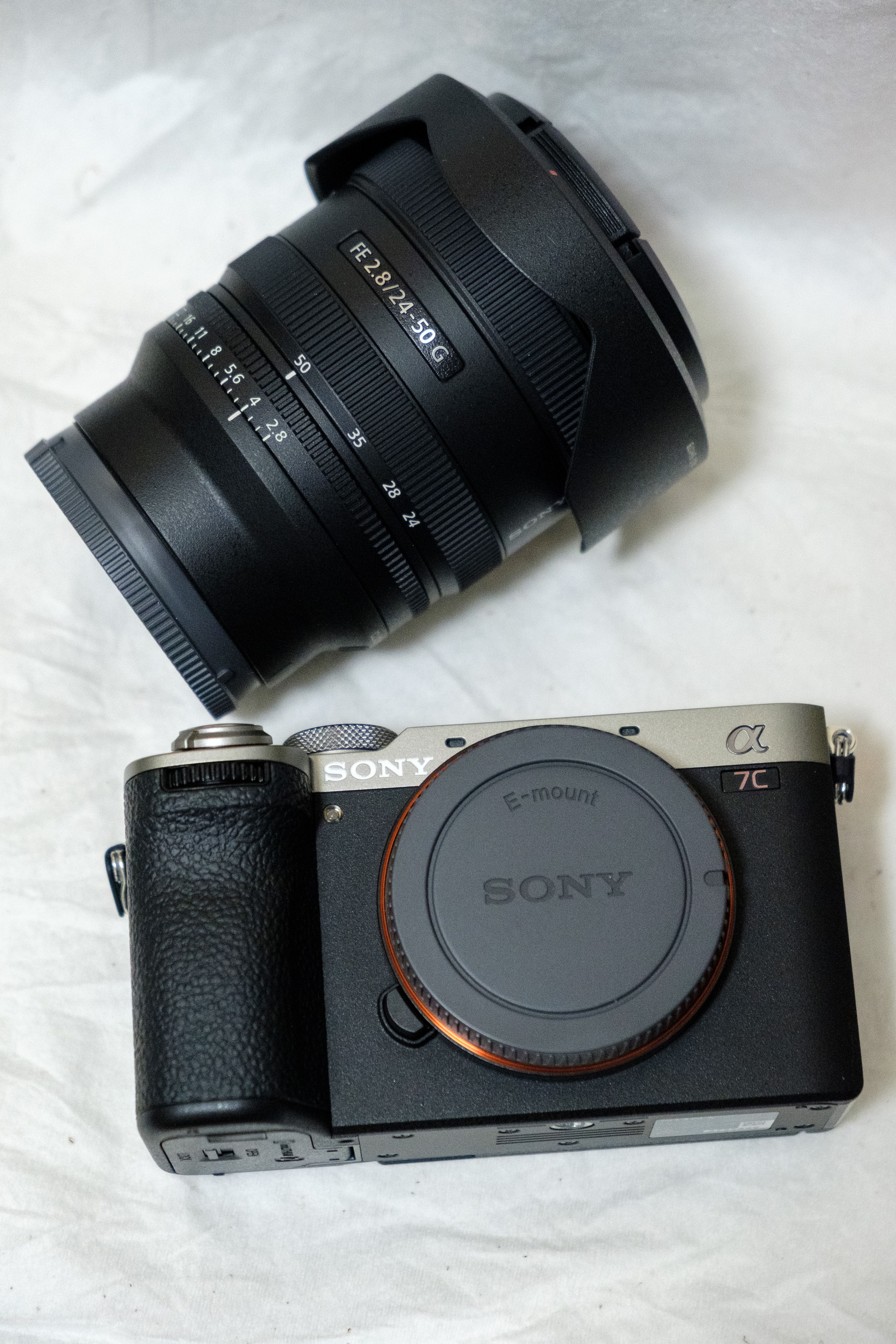 Sony Camera and Lens on White Background · Free Stock Photo