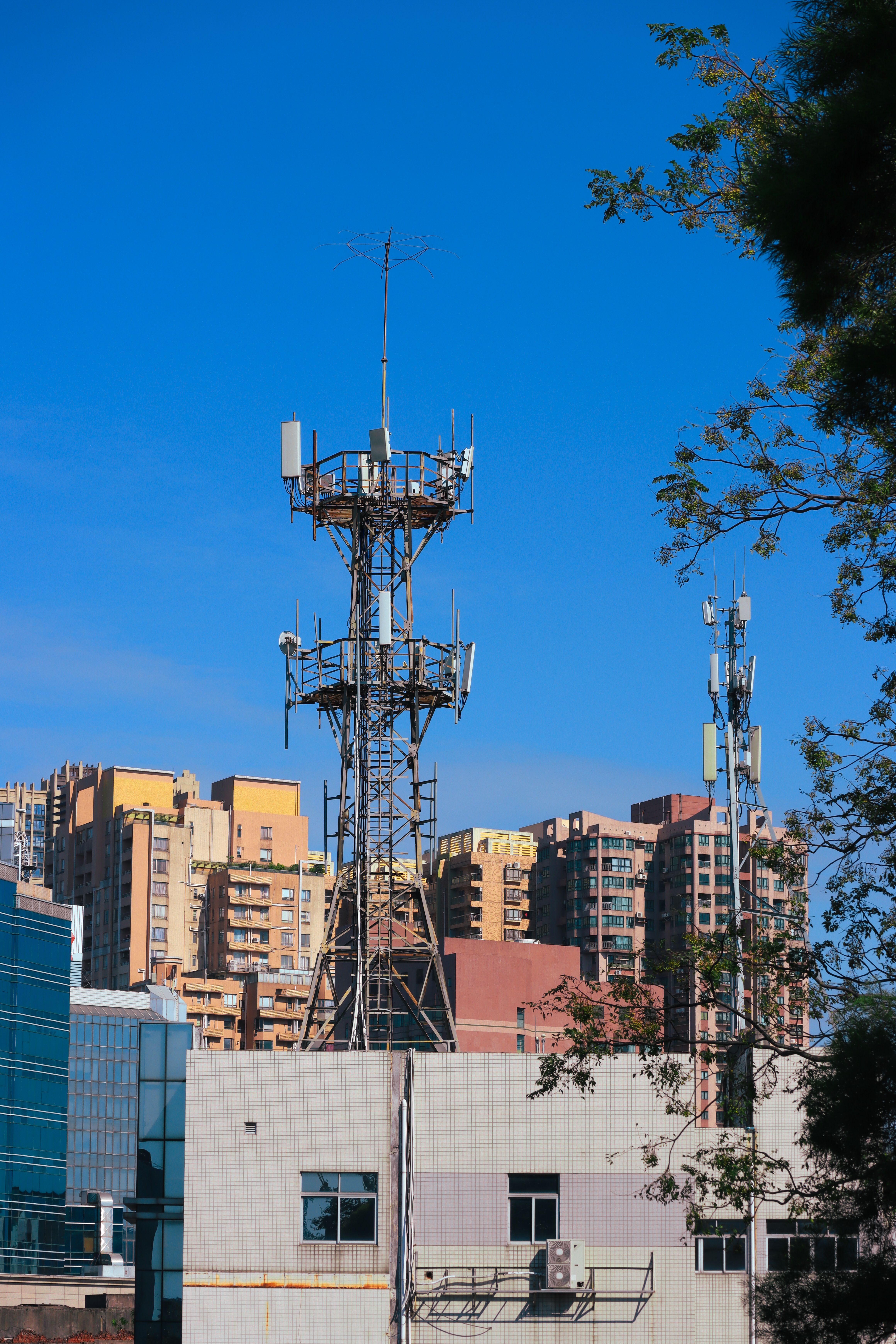 Urban Scene with Cellular Towers and Buildings · Free Stock Photo