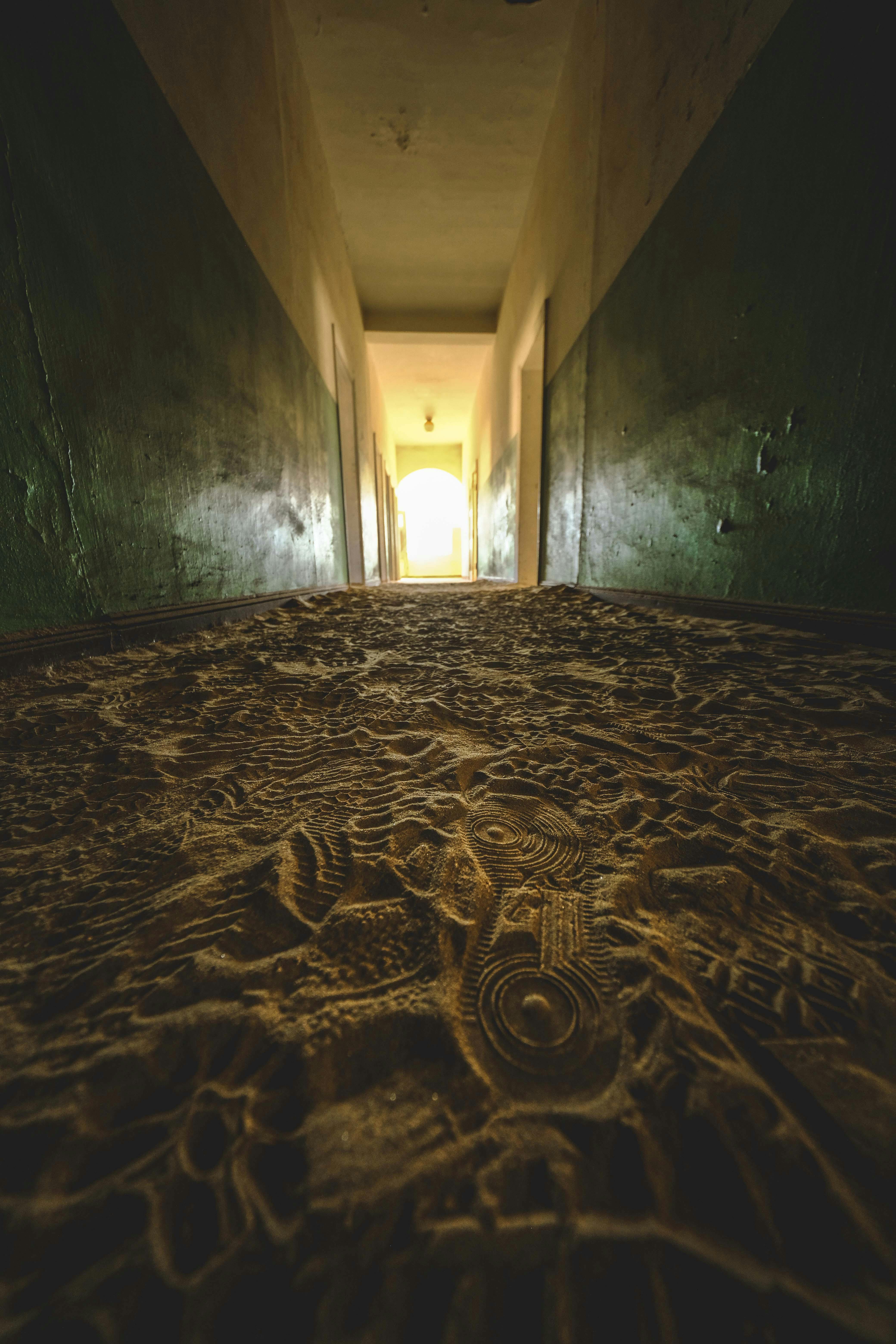 Abandoned Hallway with Sand in Kolmanskop, Namibia · Free Stock Photo