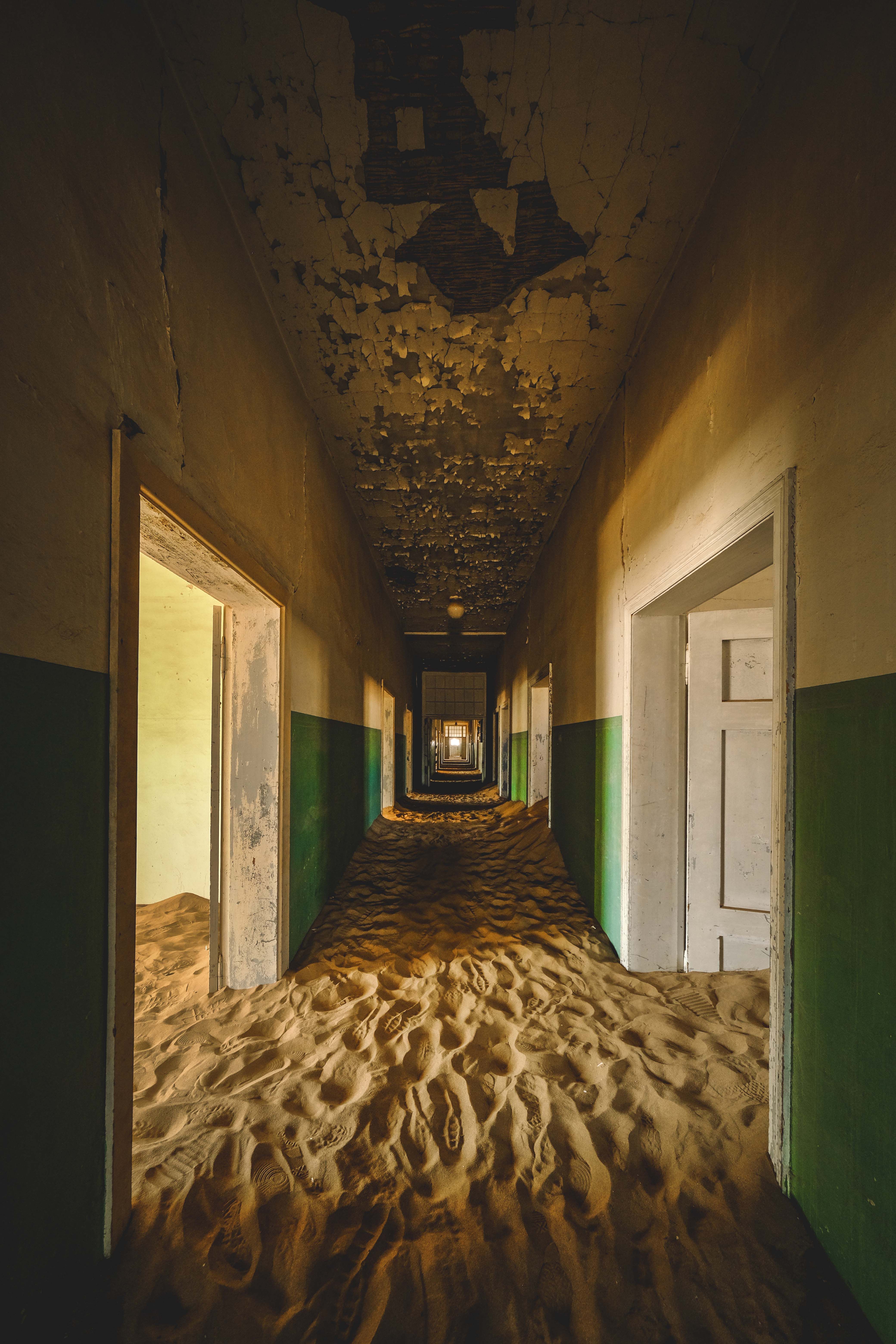 Abandoned Sand-Filled Hallway in Kolmanskop · Free Stock Photo